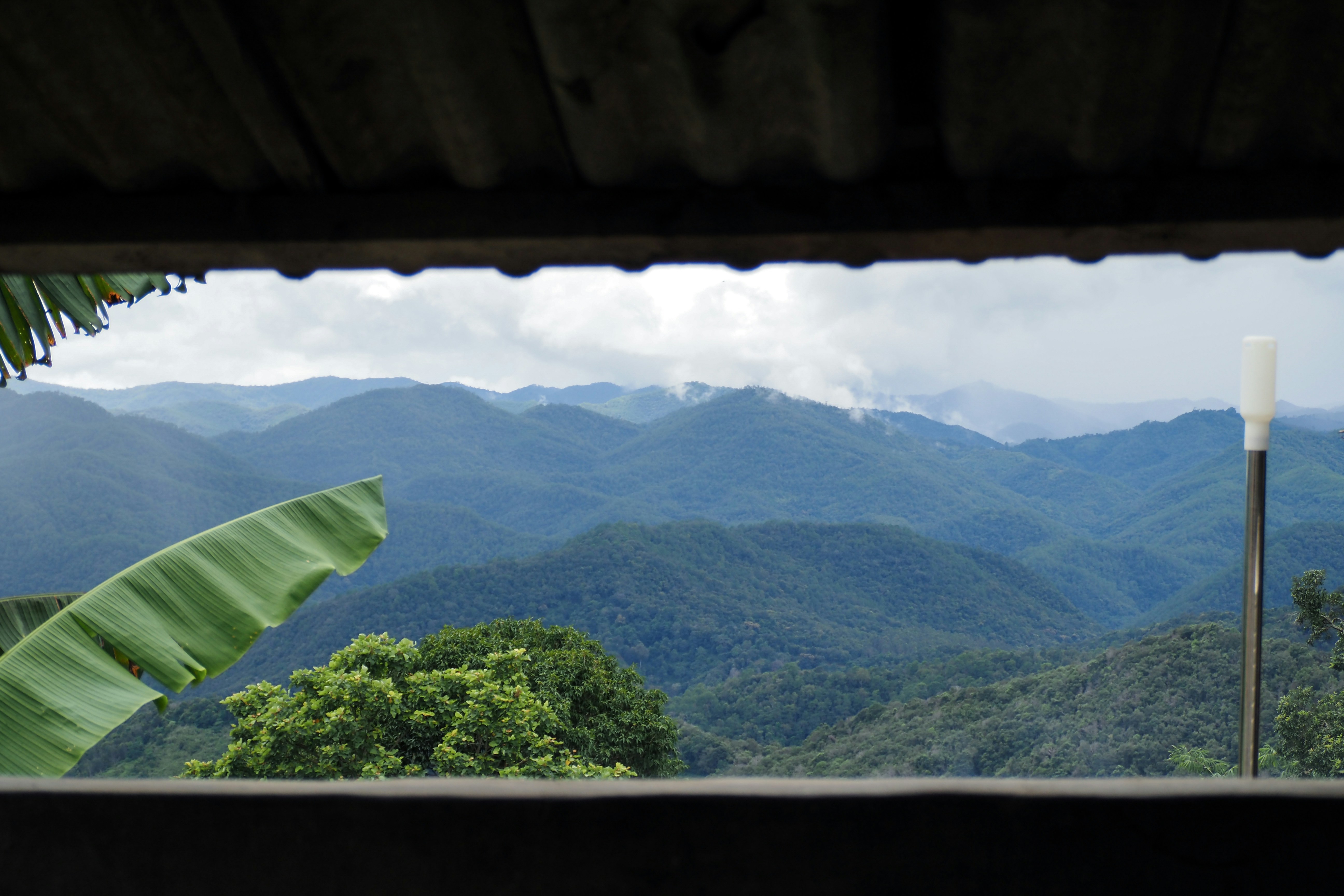 Framed Horizon: Mountain Range glimpsed through a Wide Aperture Opening