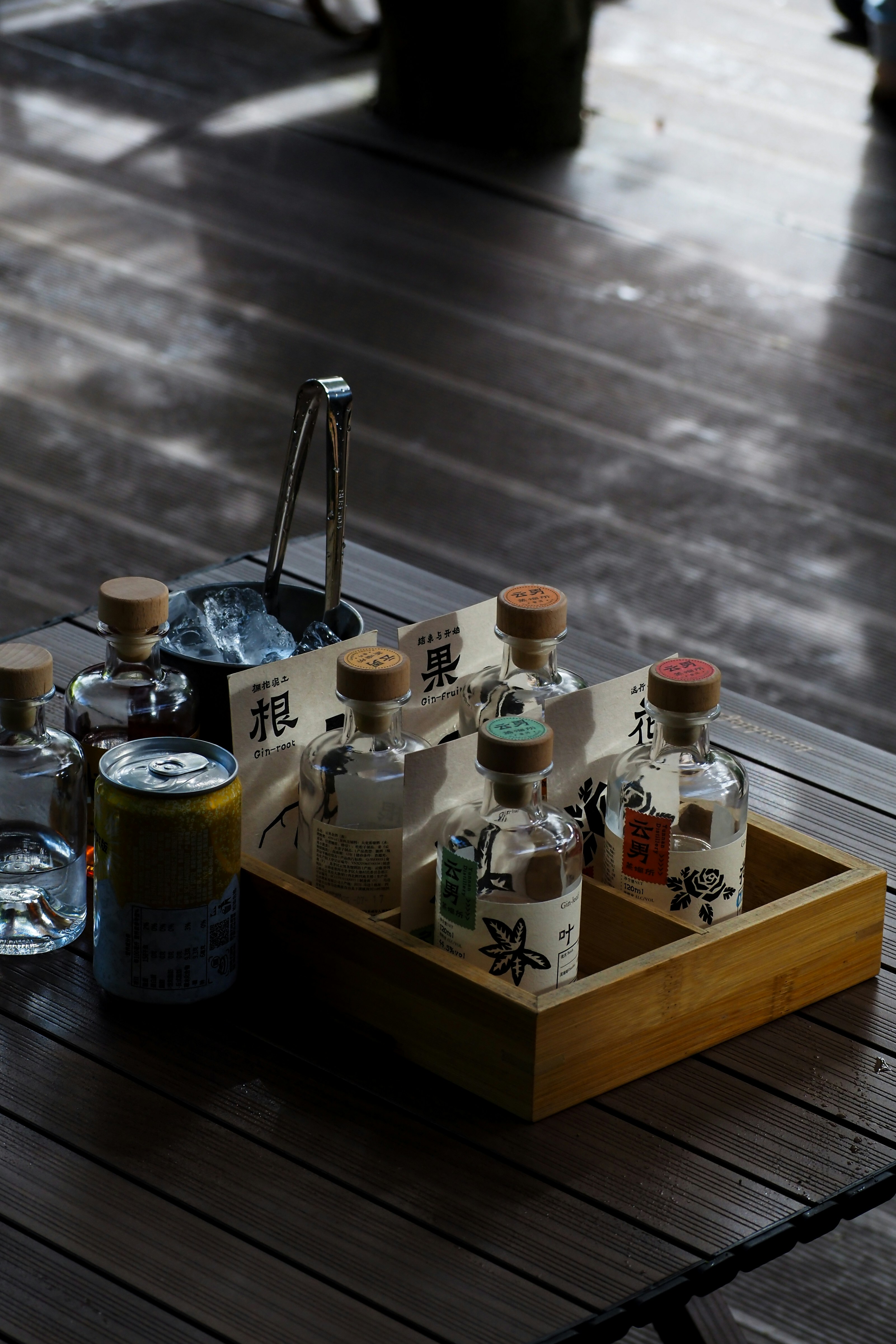 Bottled Essentials on a Wooden Market Tray