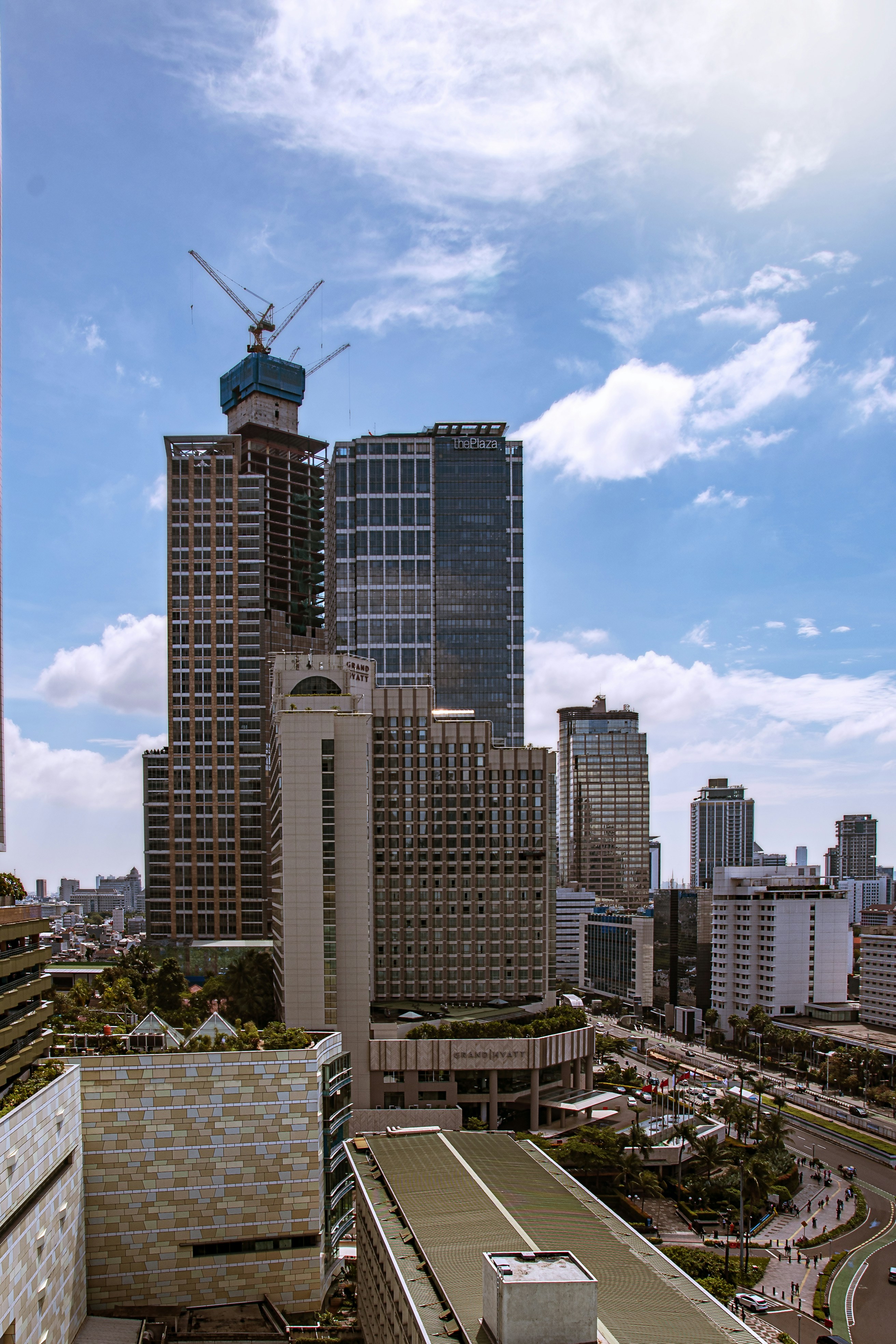 Skyline Ascent: A Towering Construction Against a Brightblue Sky