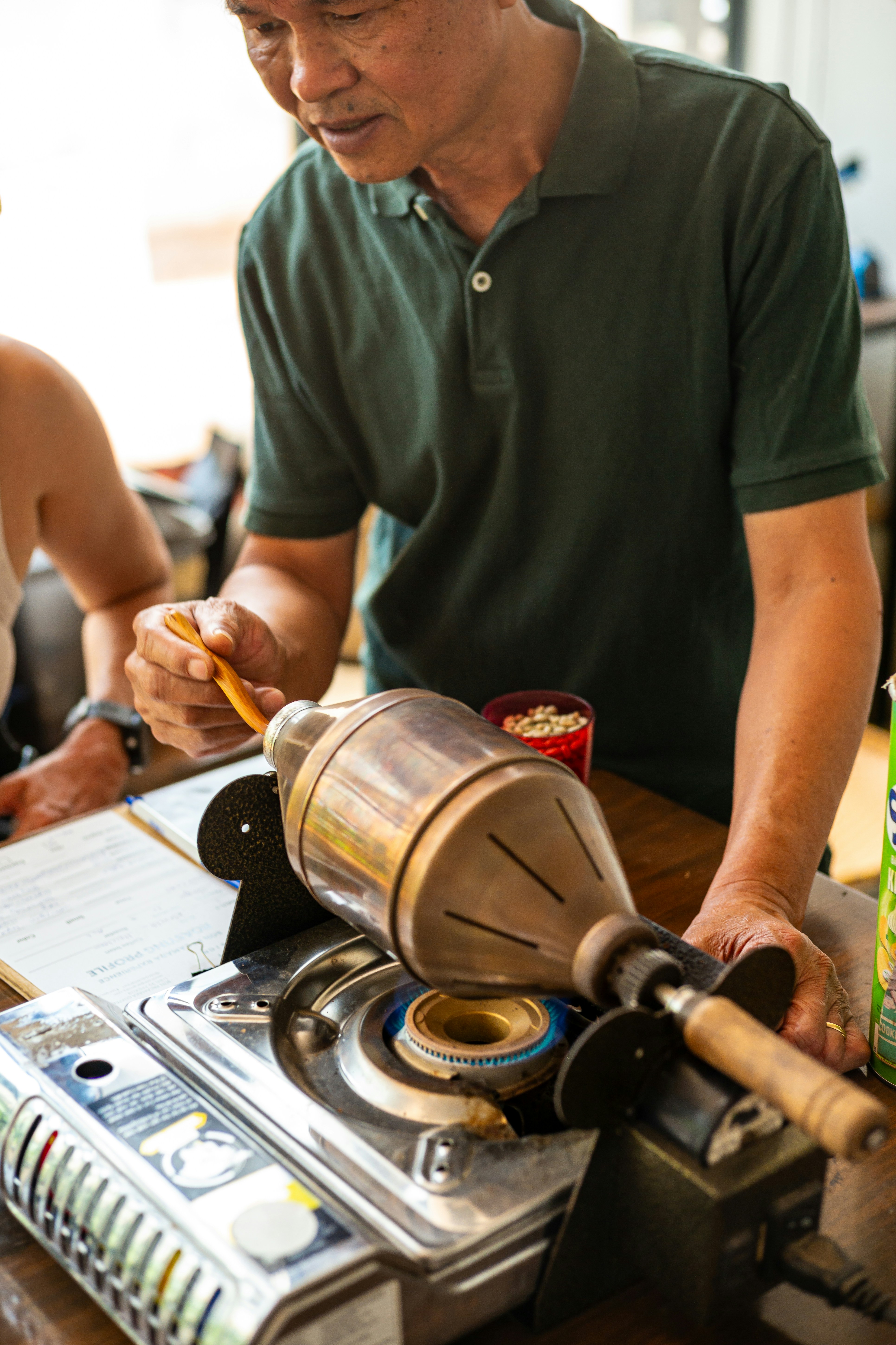 Hands Crafting a Portable Jet-Propelled Gadget at a Workshop