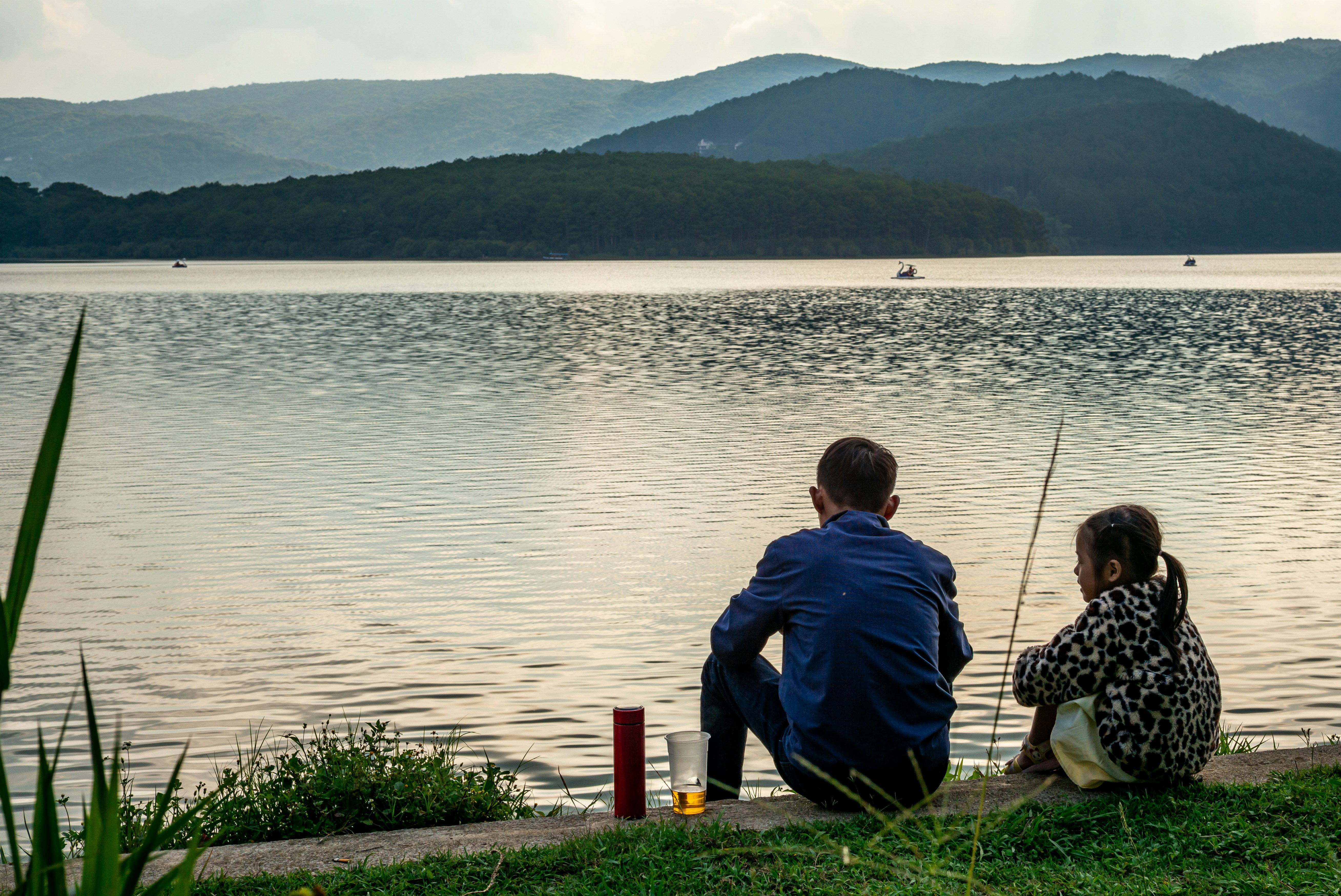 Quiet Moment by the Lakeside: A Pair in Reflection