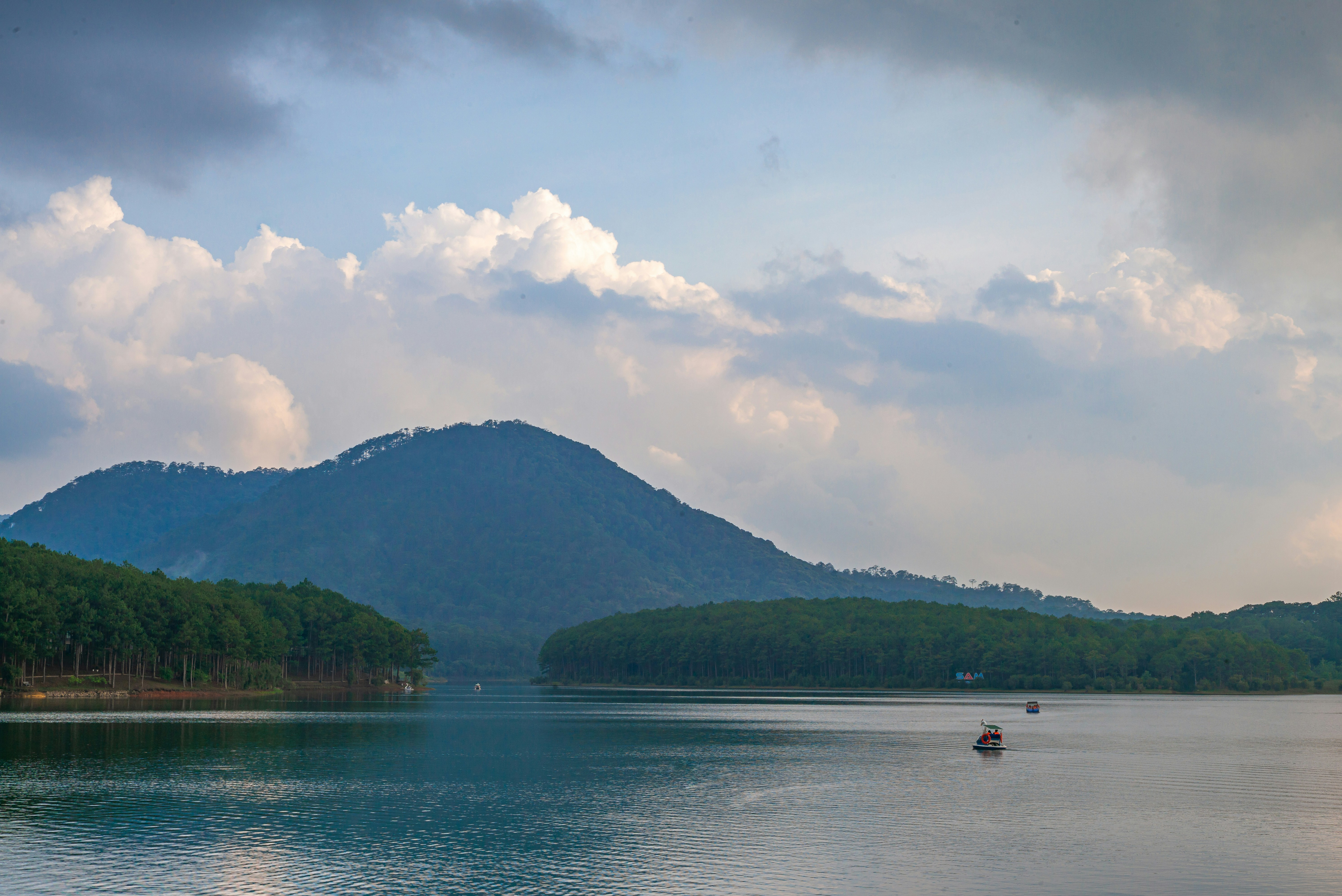 Calm Lake Converging with Green Hills at Dusk