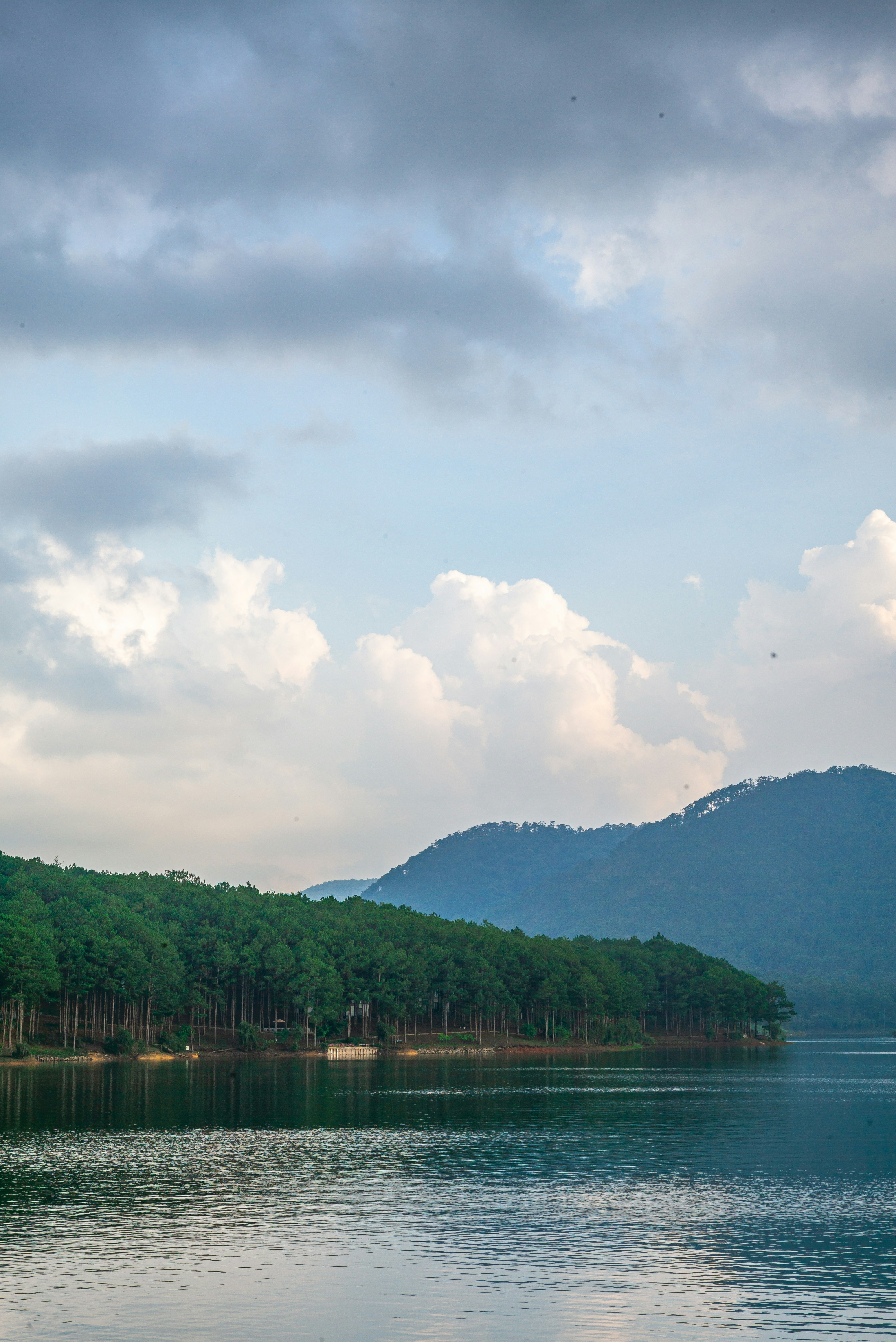 Serene Lakeside Ridge Under a Veiled Sky