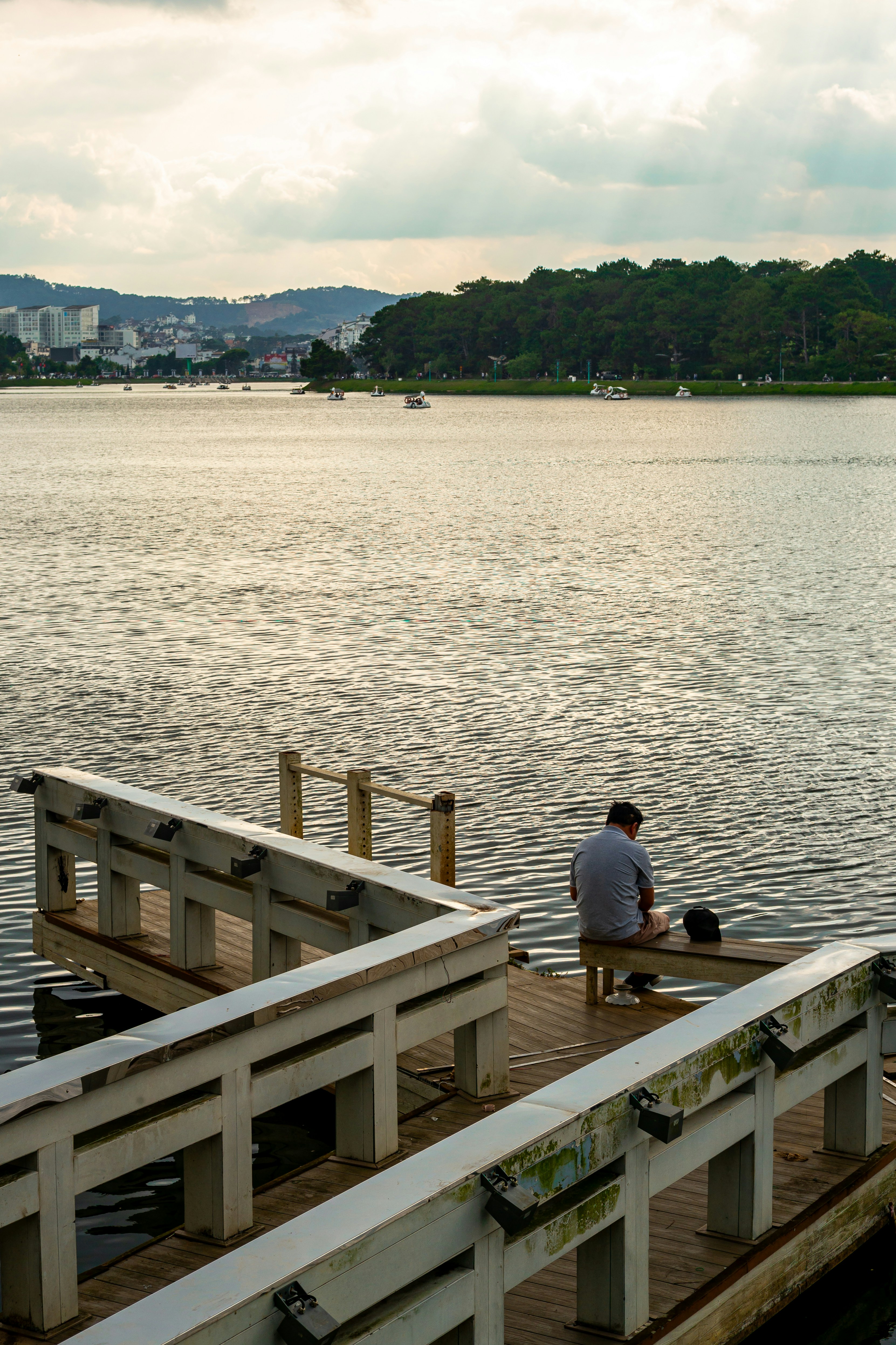 Quiet Moment on the Pier: Father and Child by the Water