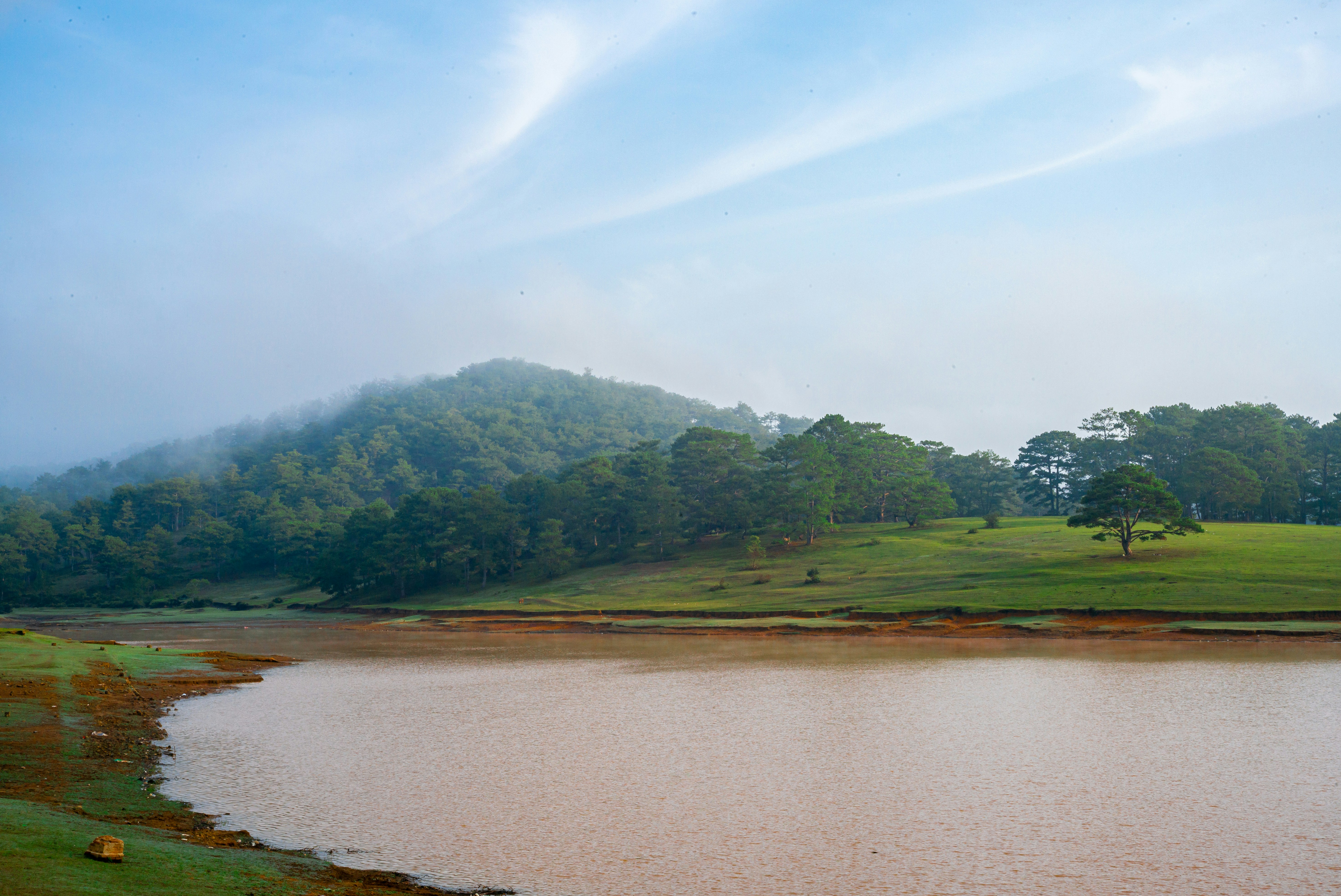 Misty Lake Ridge: Quiet Hill and Waterline at Dusk