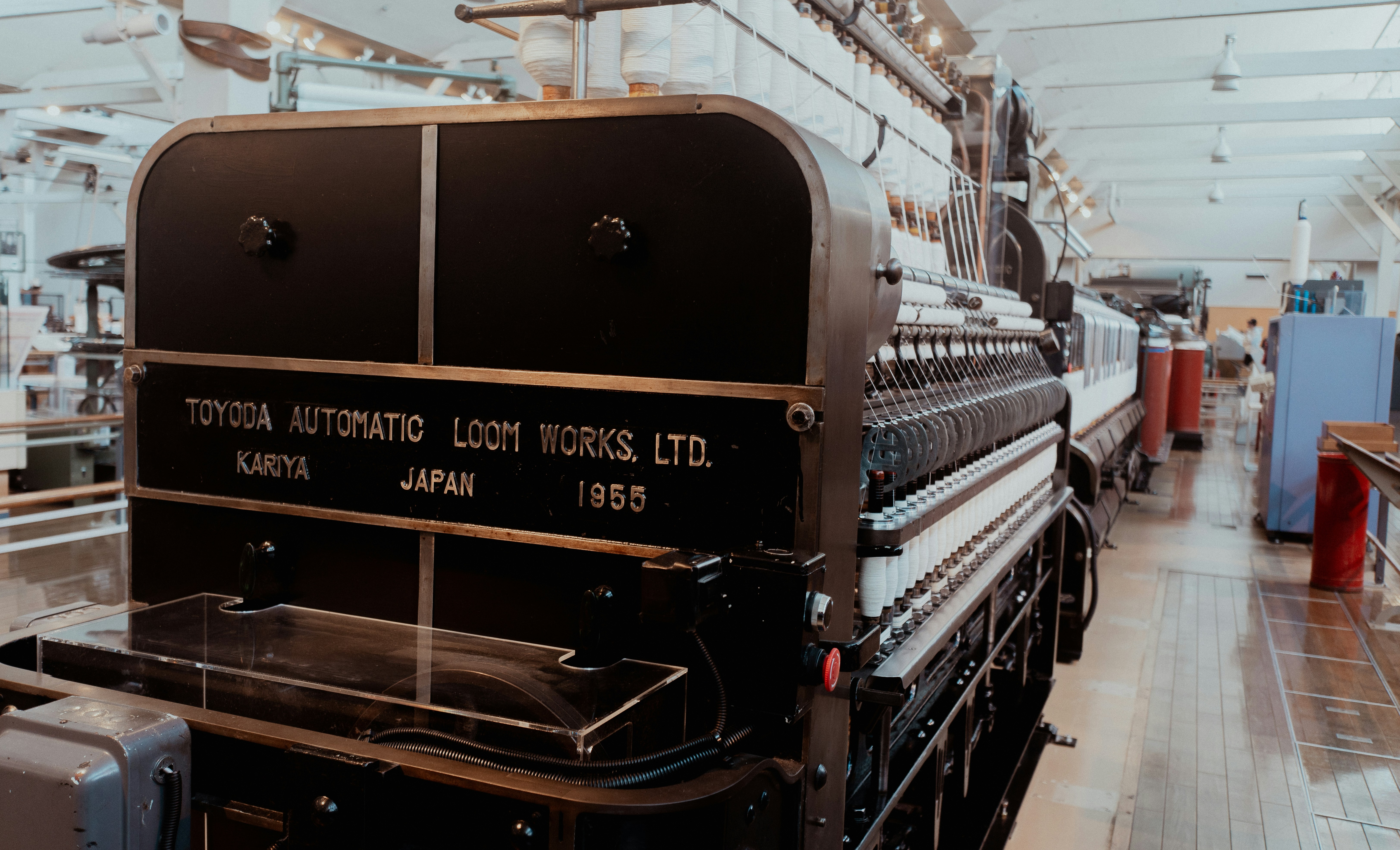 Looming Precision: A Historic Textile Loom in a Quiet Factory Hall