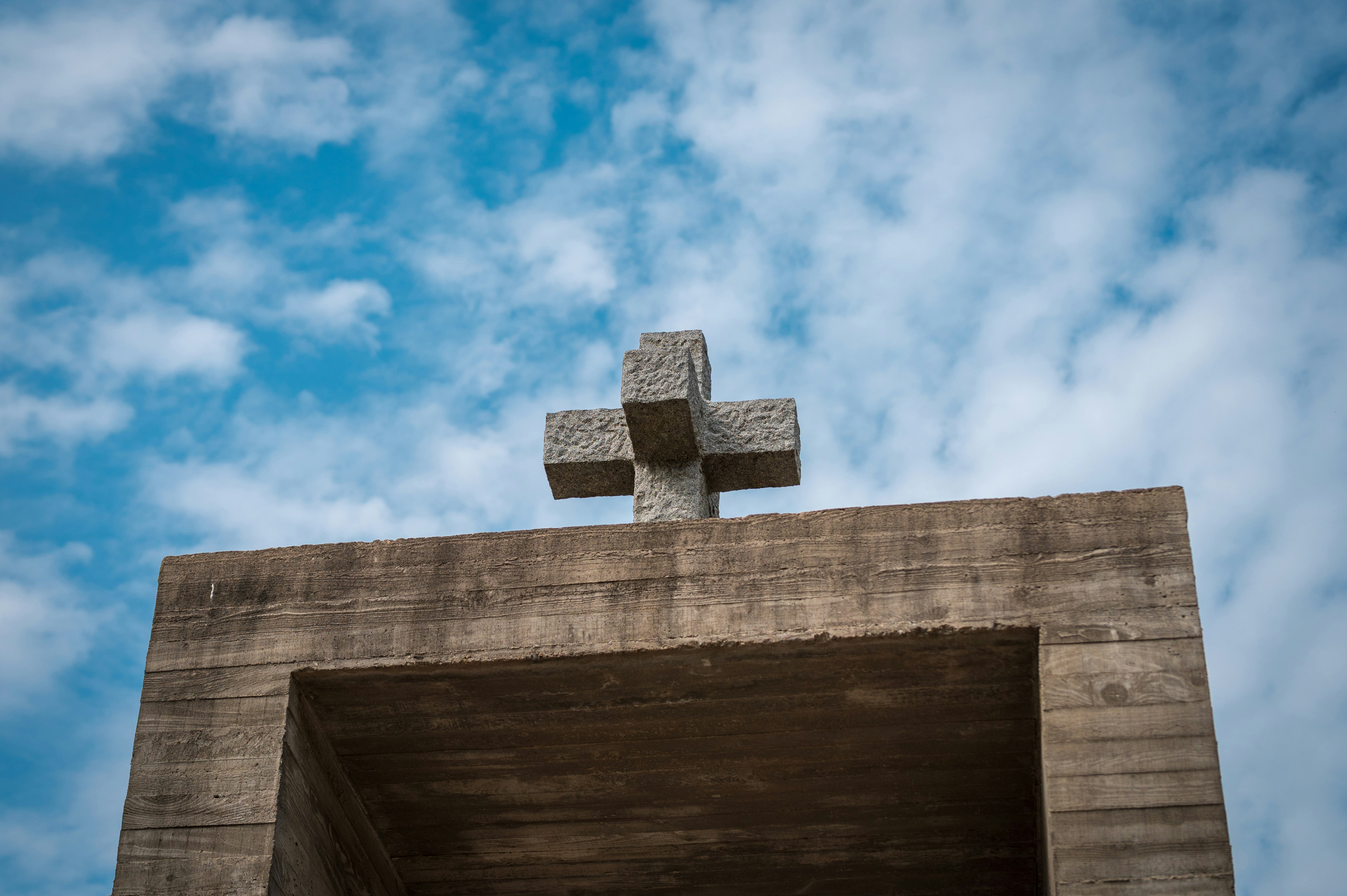 Concrete Cross at the Summit: A Skyward Frame
