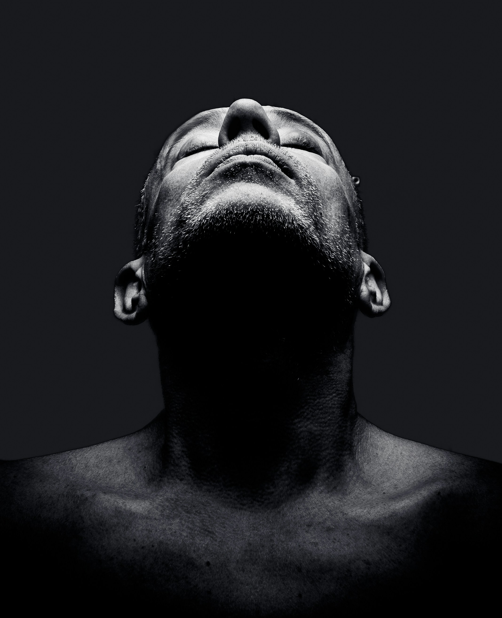 Upturned Gaze: A Portrait of Shadow and Light