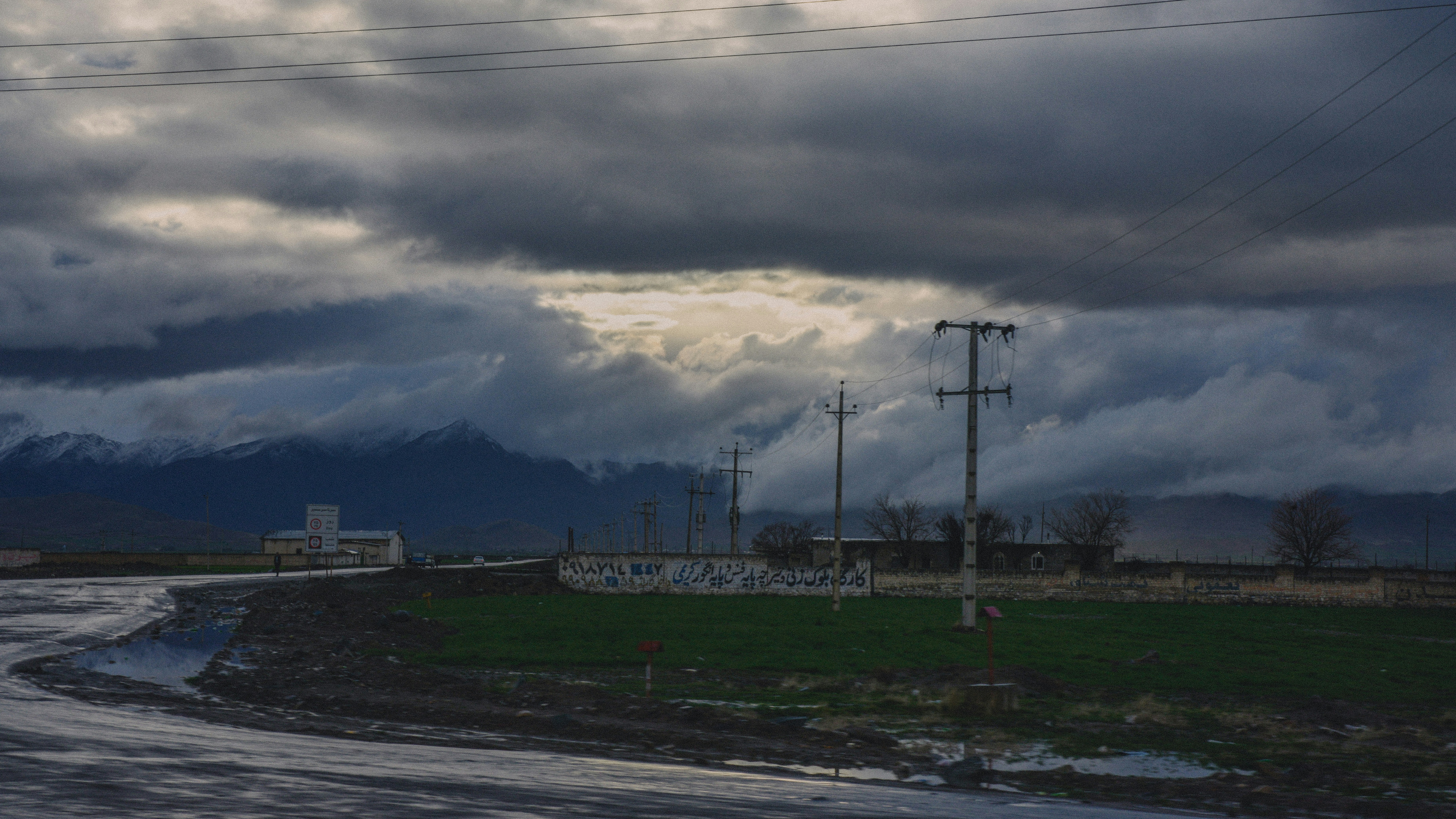 Storm-graded horizon over a rural riverbank