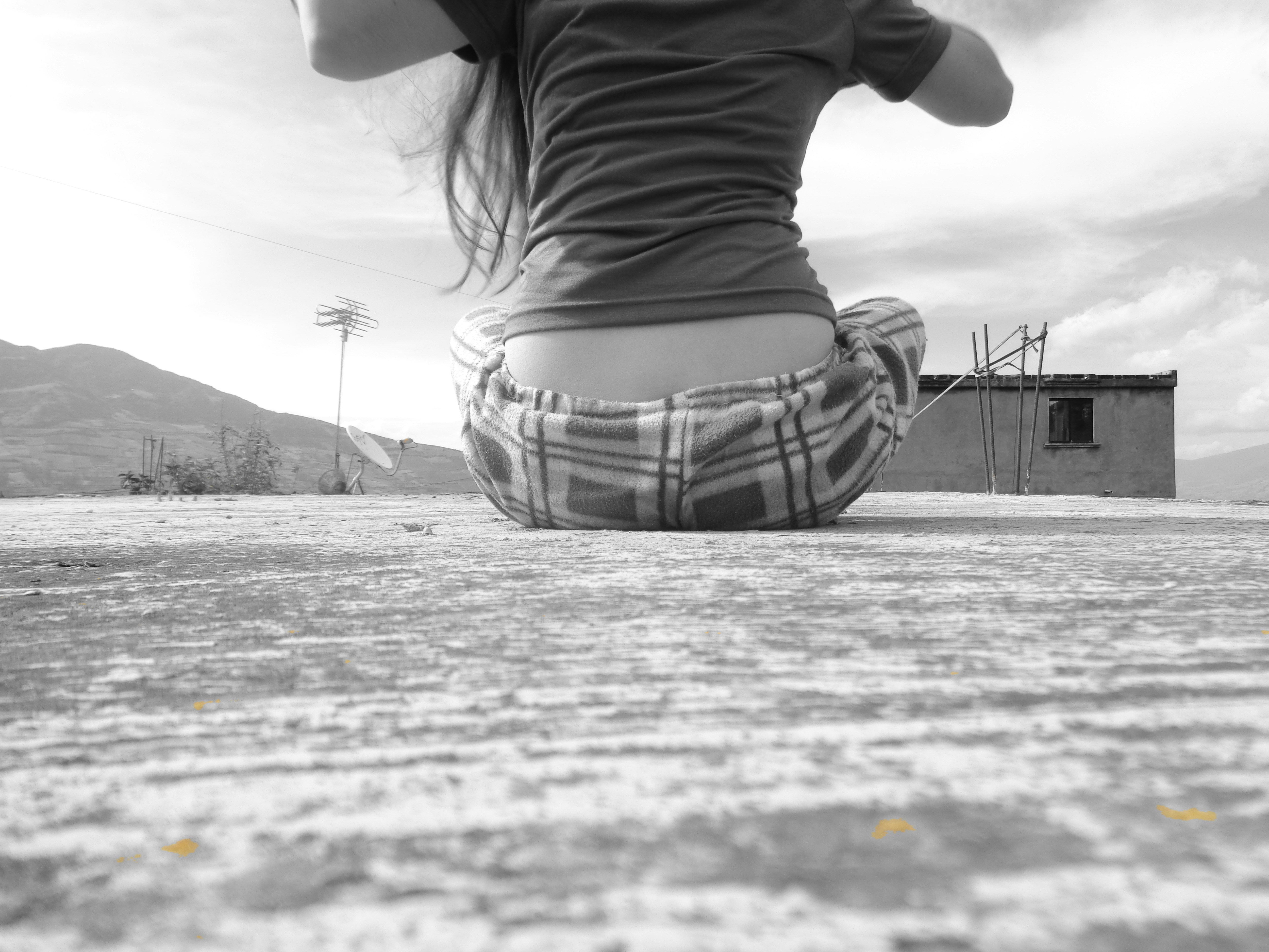 Grounded in Focus: The Distant Rooftop and Childish Back View