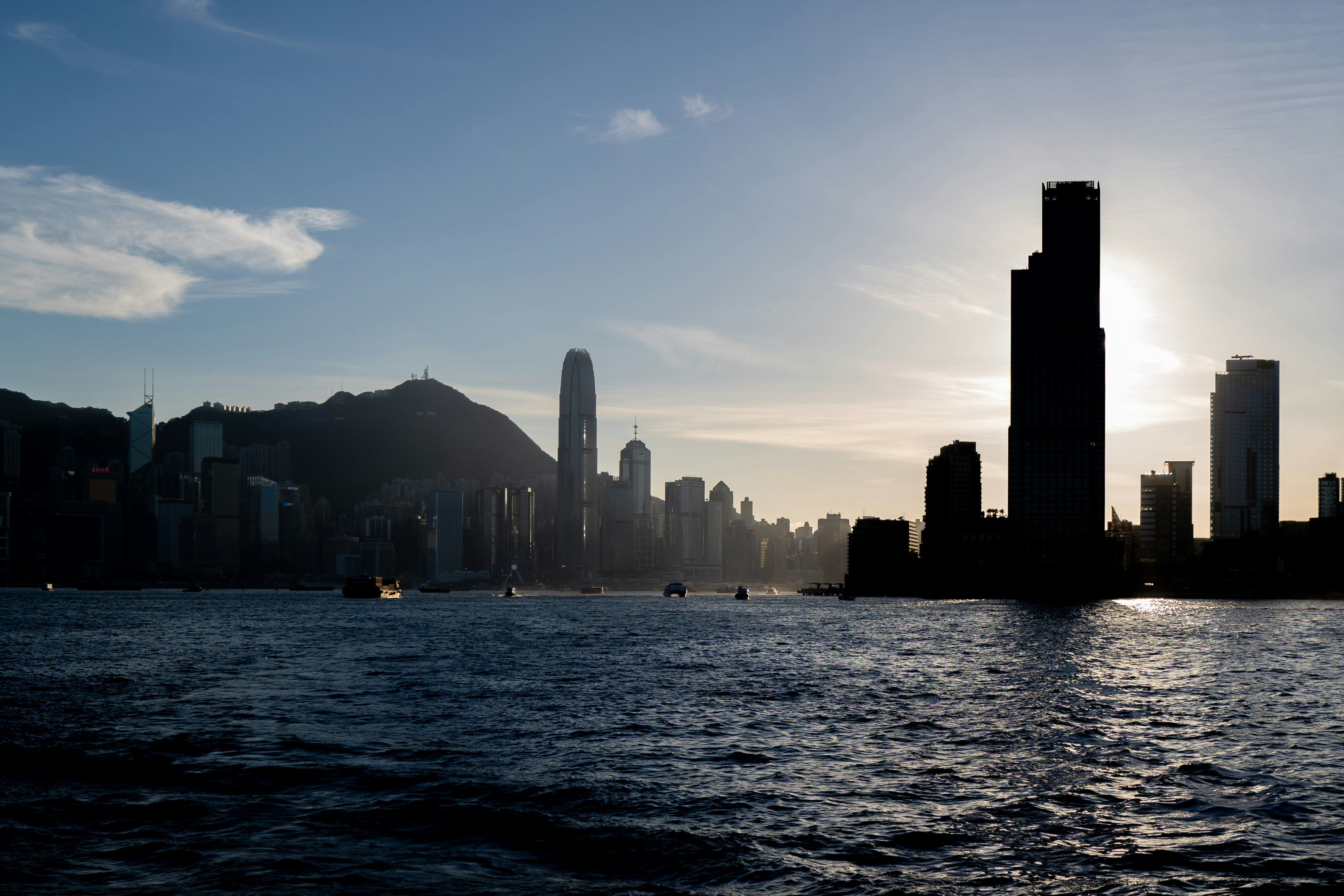 Silhouette of a Coastal City: Dusk Over the Waterfront