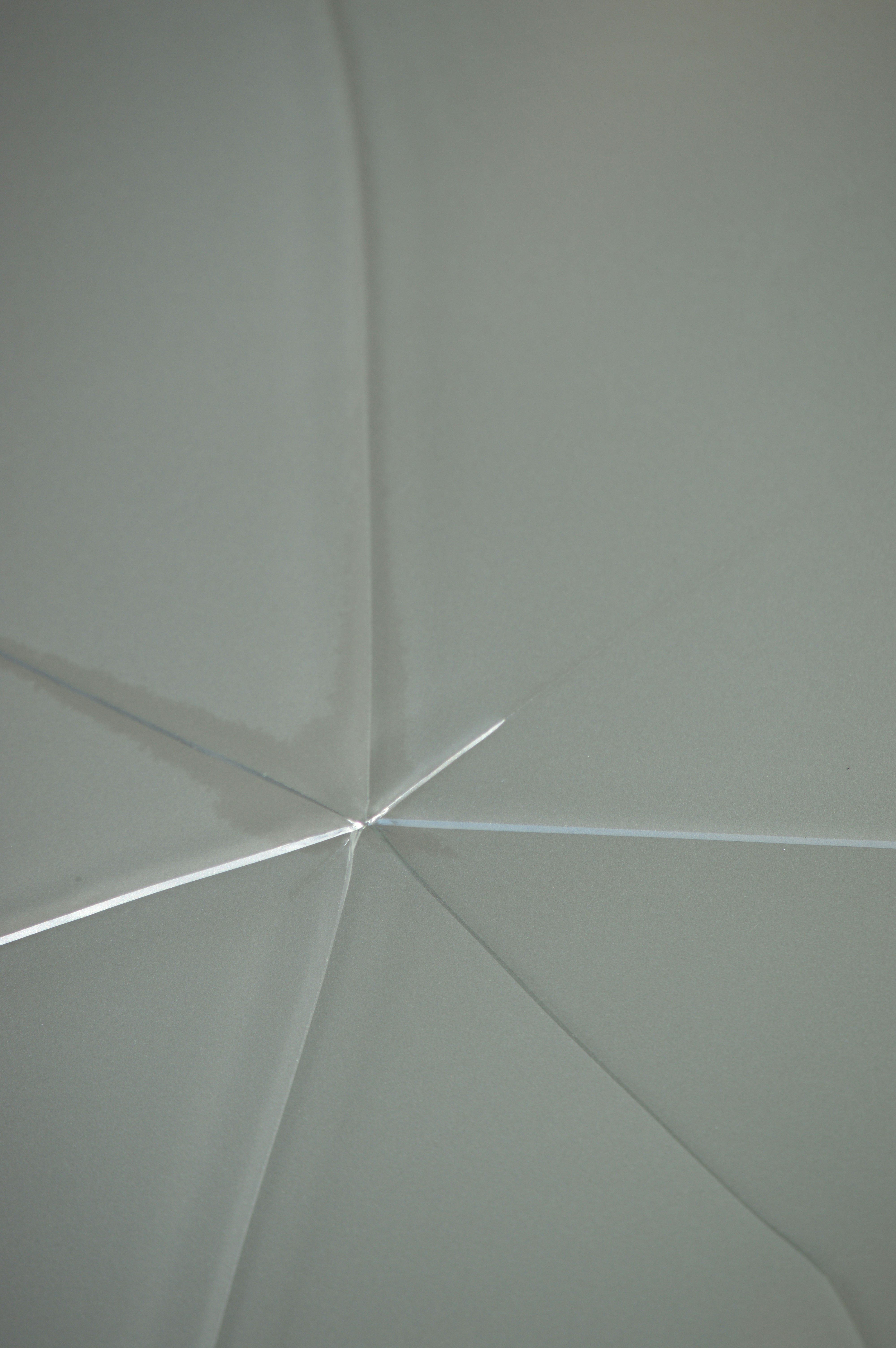 Soft Crumple: Abstract Light Play on a Pale Surface