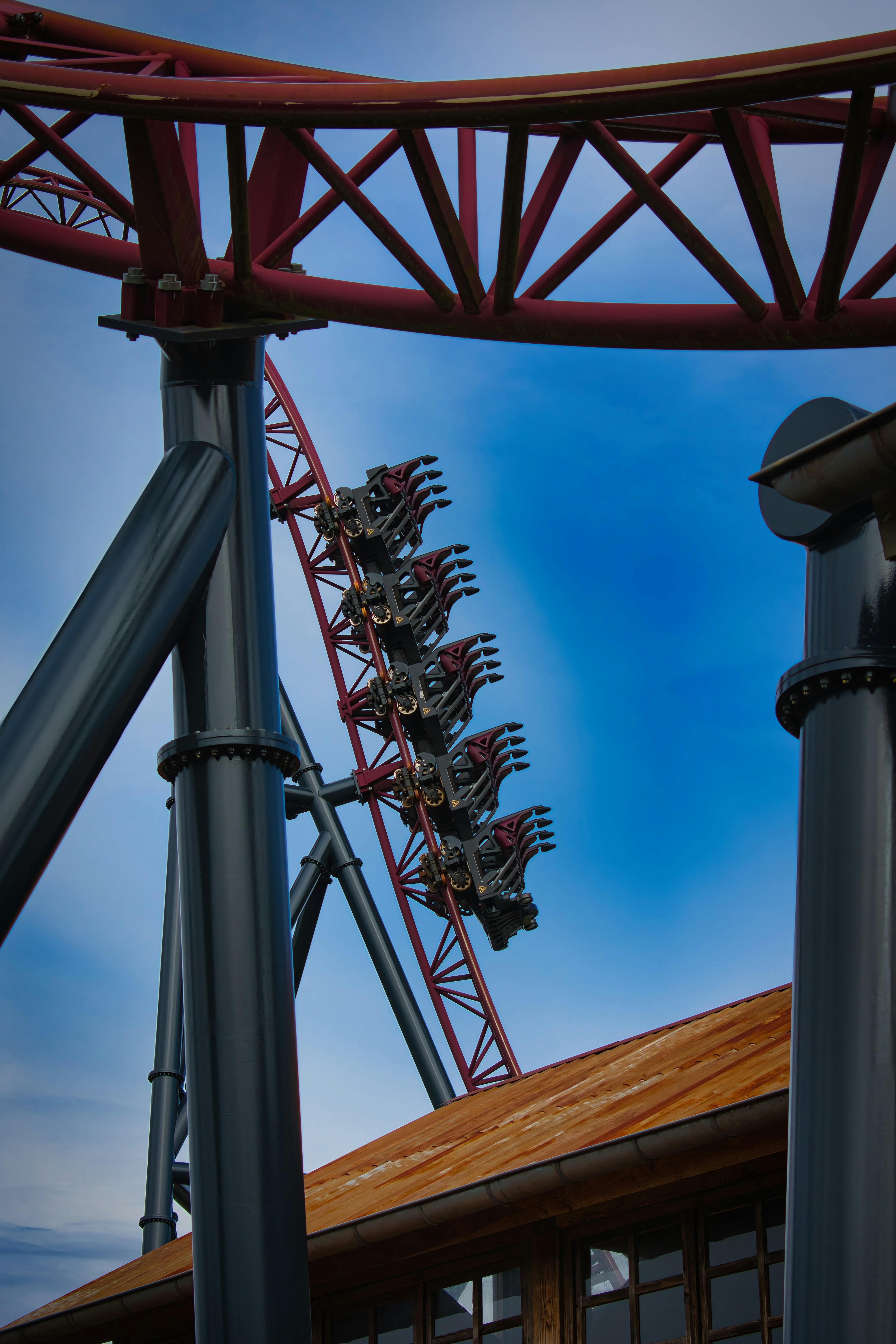 Red Steel Arcs: A Roller Coaster Slice Through Steel and Sky