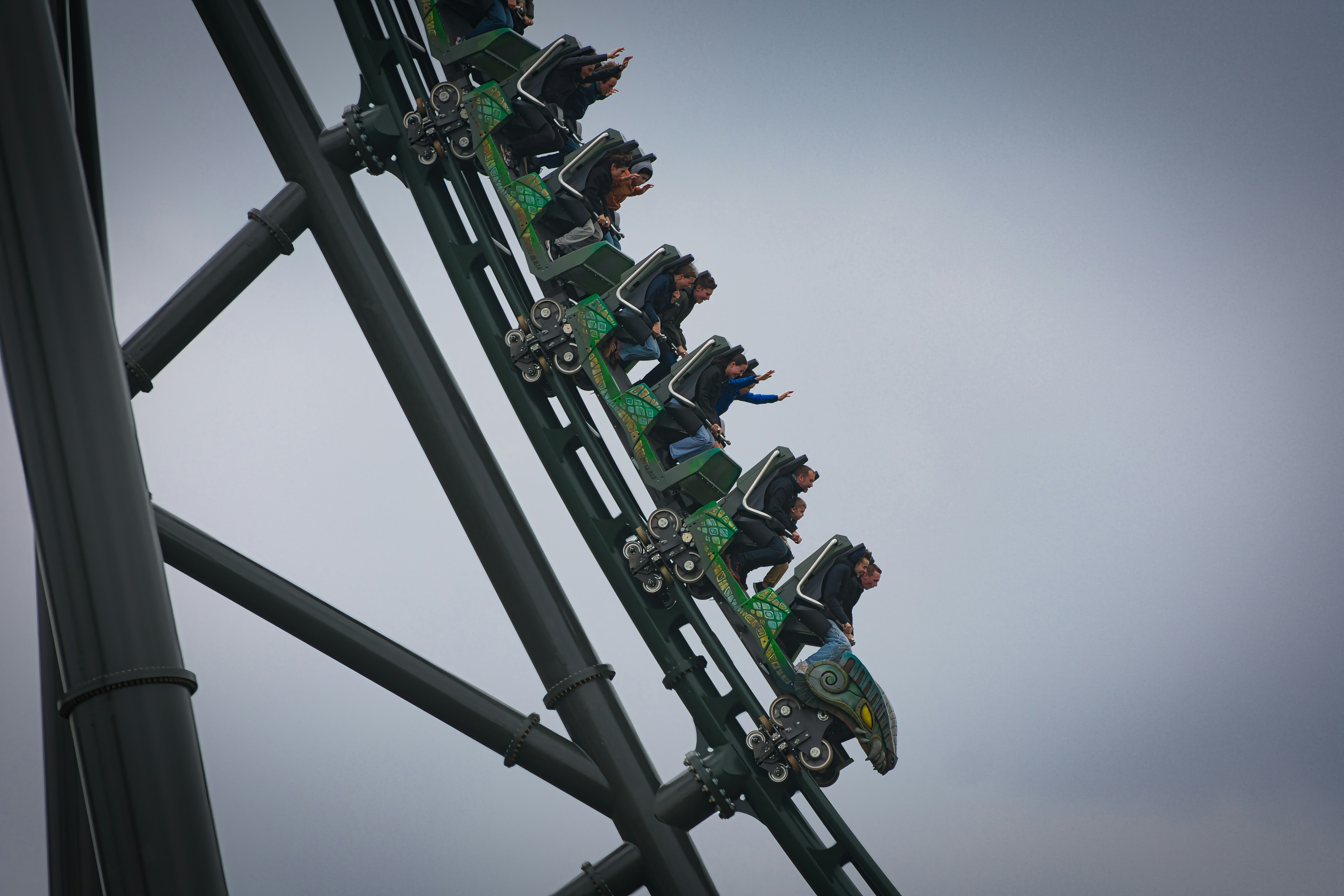 Tilted Ascent: A Line of Thrill-Seeking Cars Climb the Loop