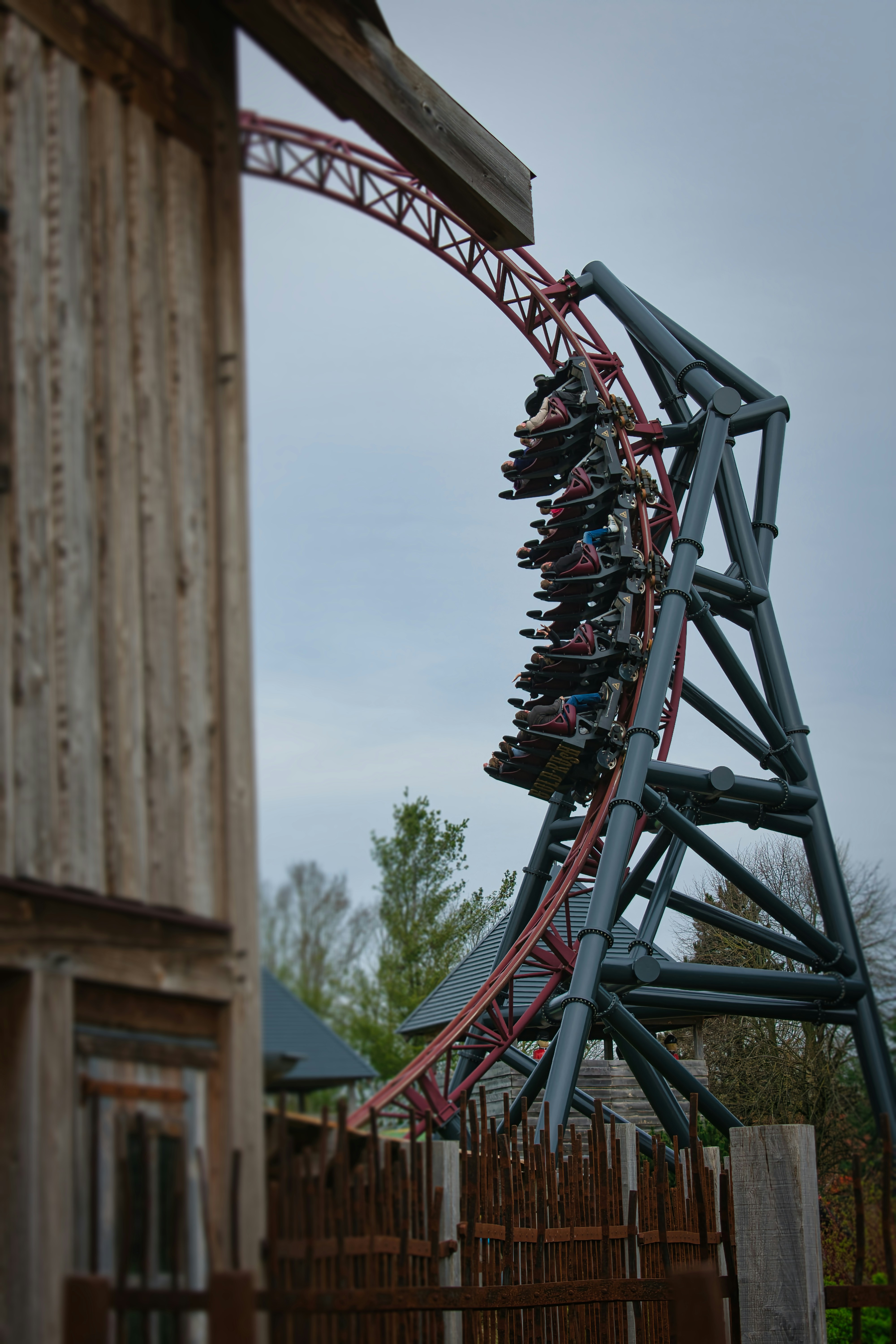 Rider Rollercoaster Swing: A Looping Moment Between Wood and Steel