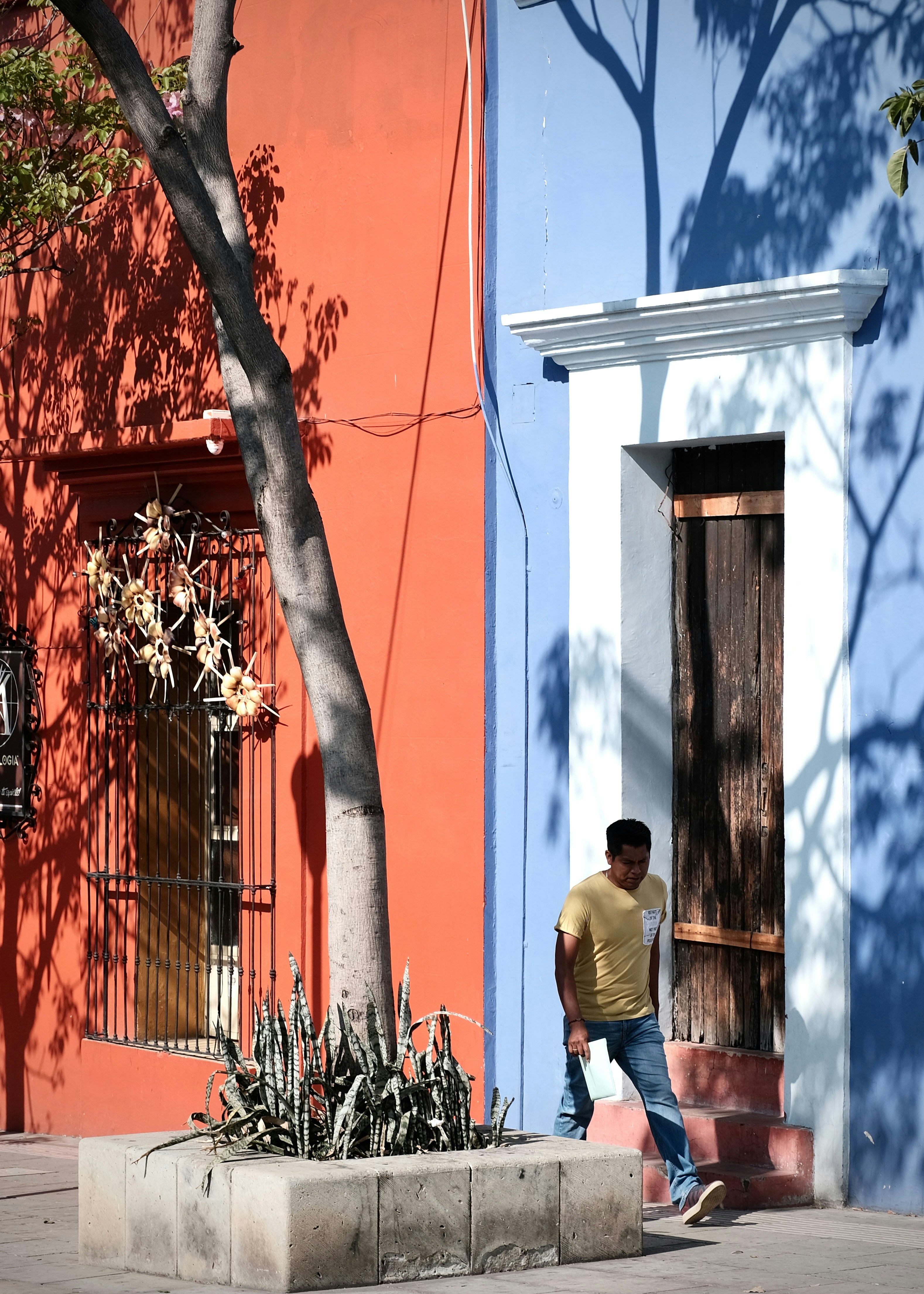 Color-Washed Facade Portrait with a Quiet passerby