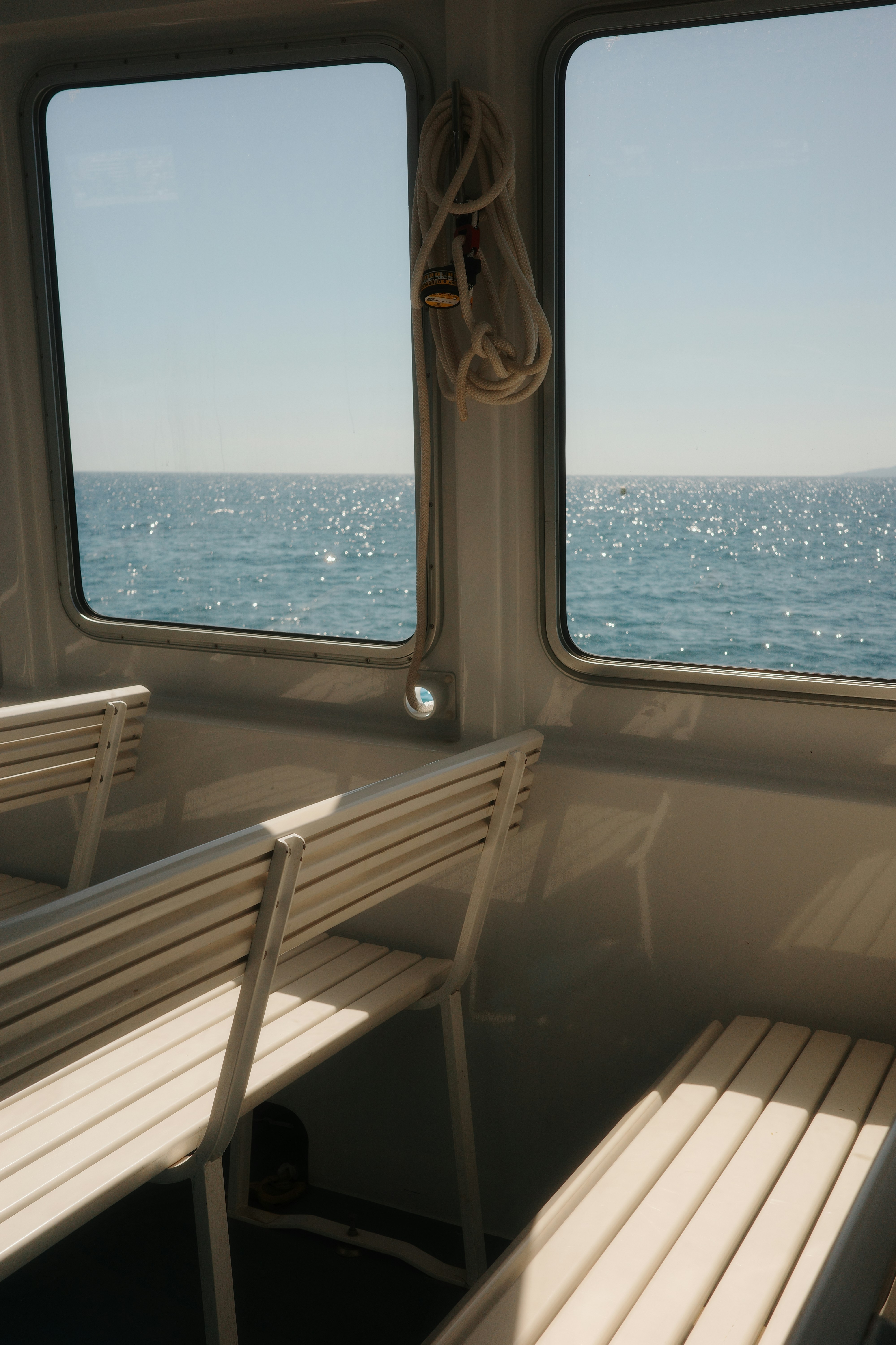 Sunlit Sea Through a Vessel's Window: Minimal Seating, Maximum Horizon