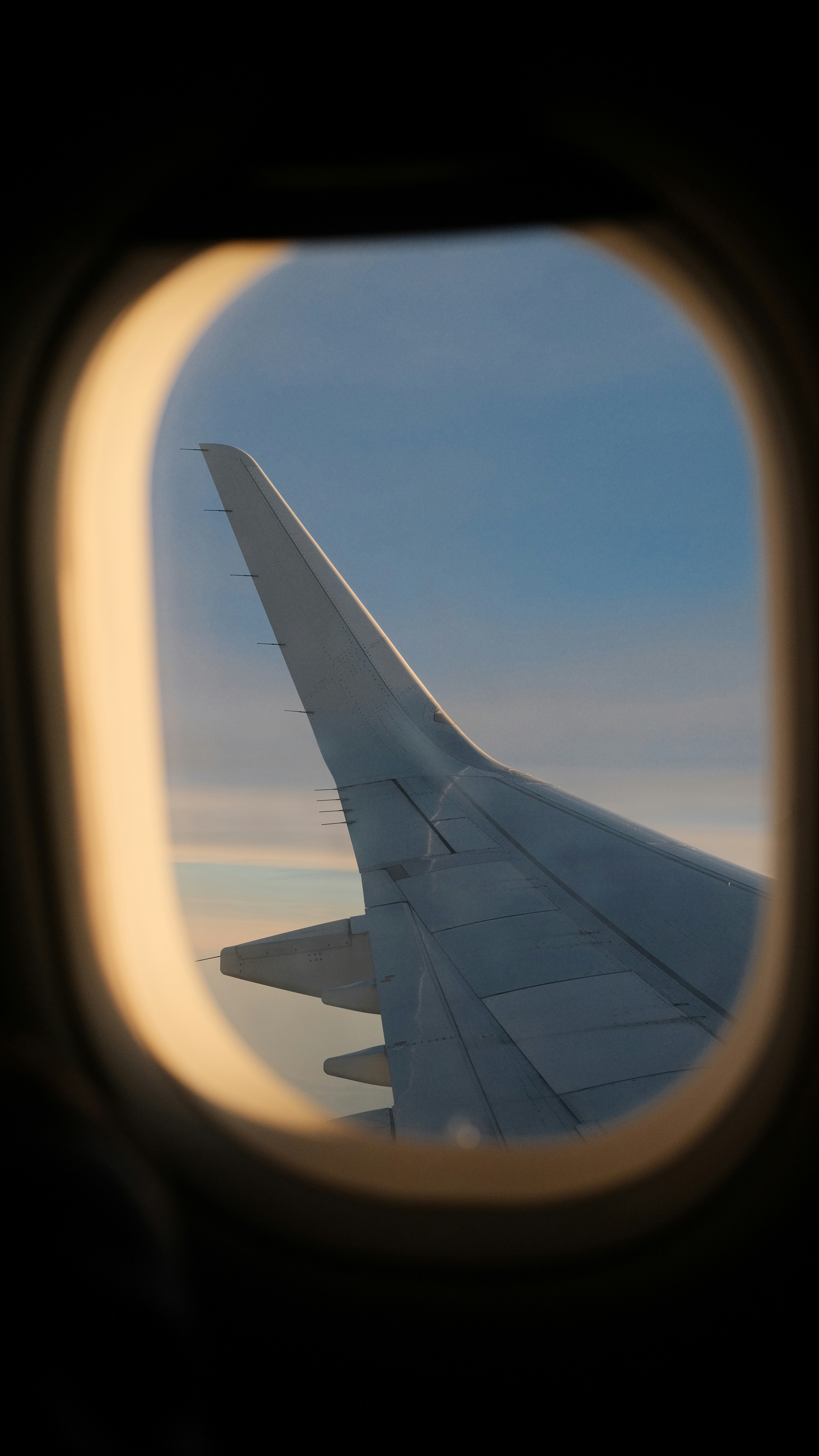Wingtip Portrait: Sunset Light on an Aerial Window