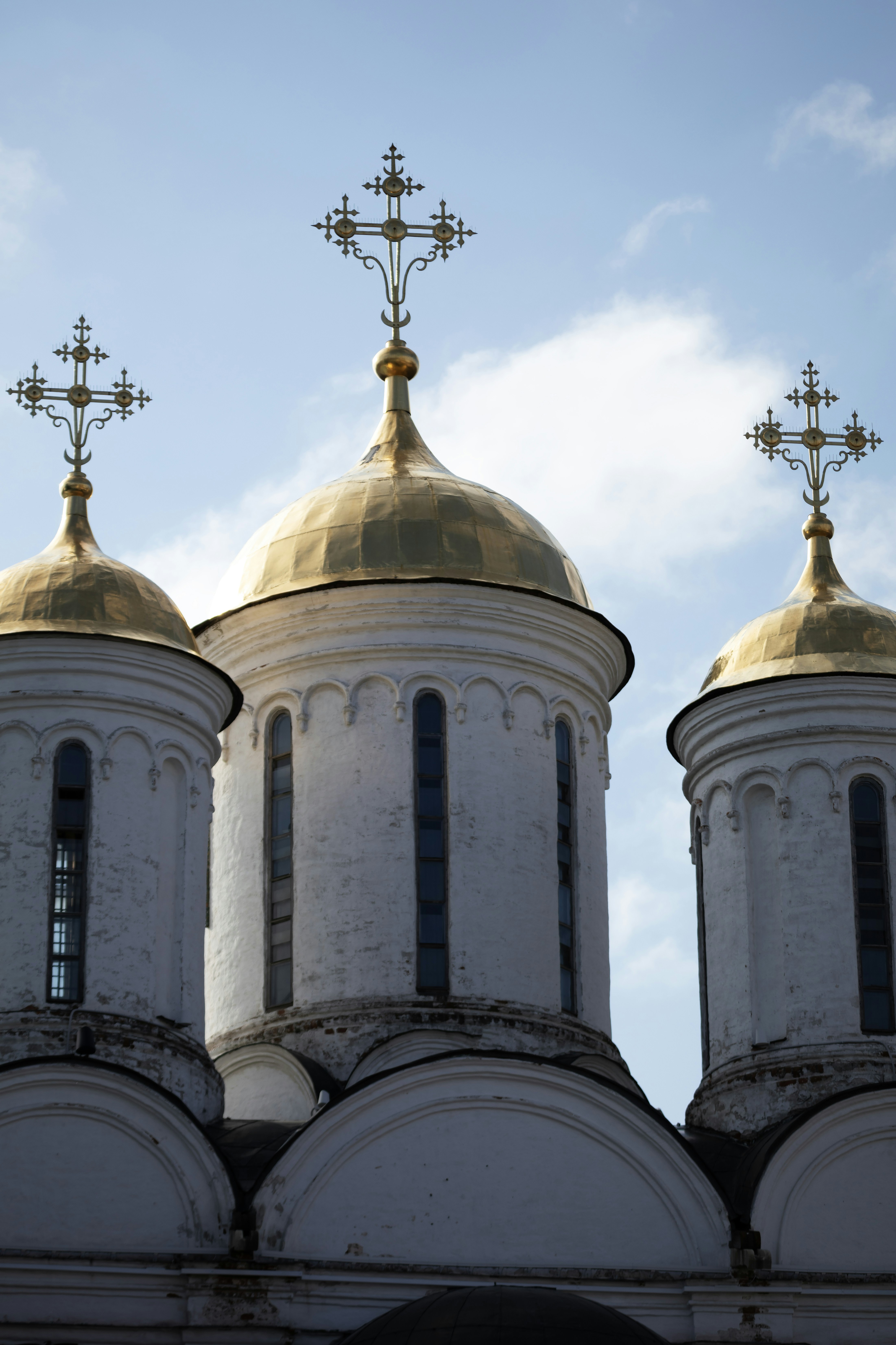 Golden domes under a bright sky: Orthodox church towers rising in harmony
