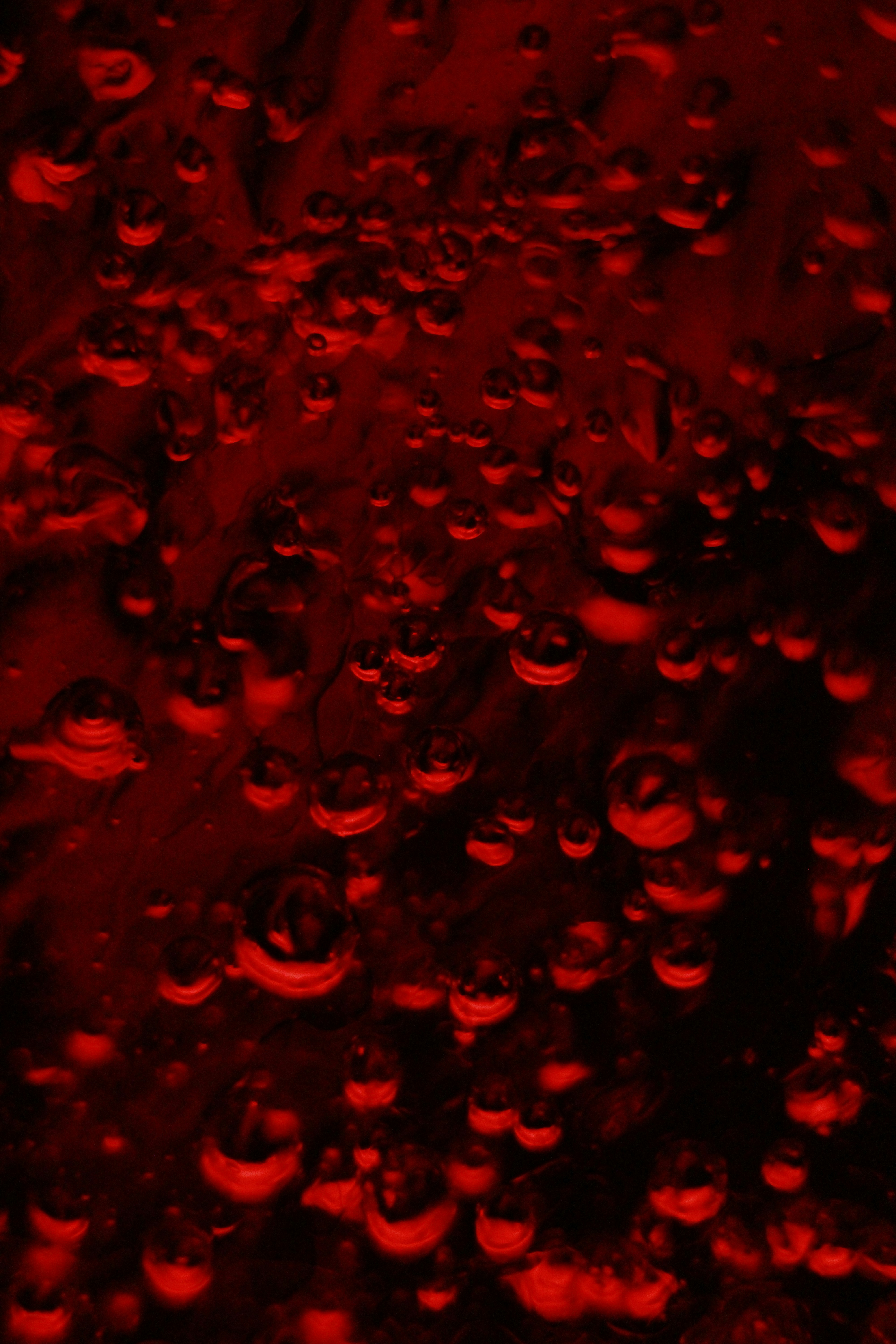 Crimson Ripples: Bubbles in a Veil of Red