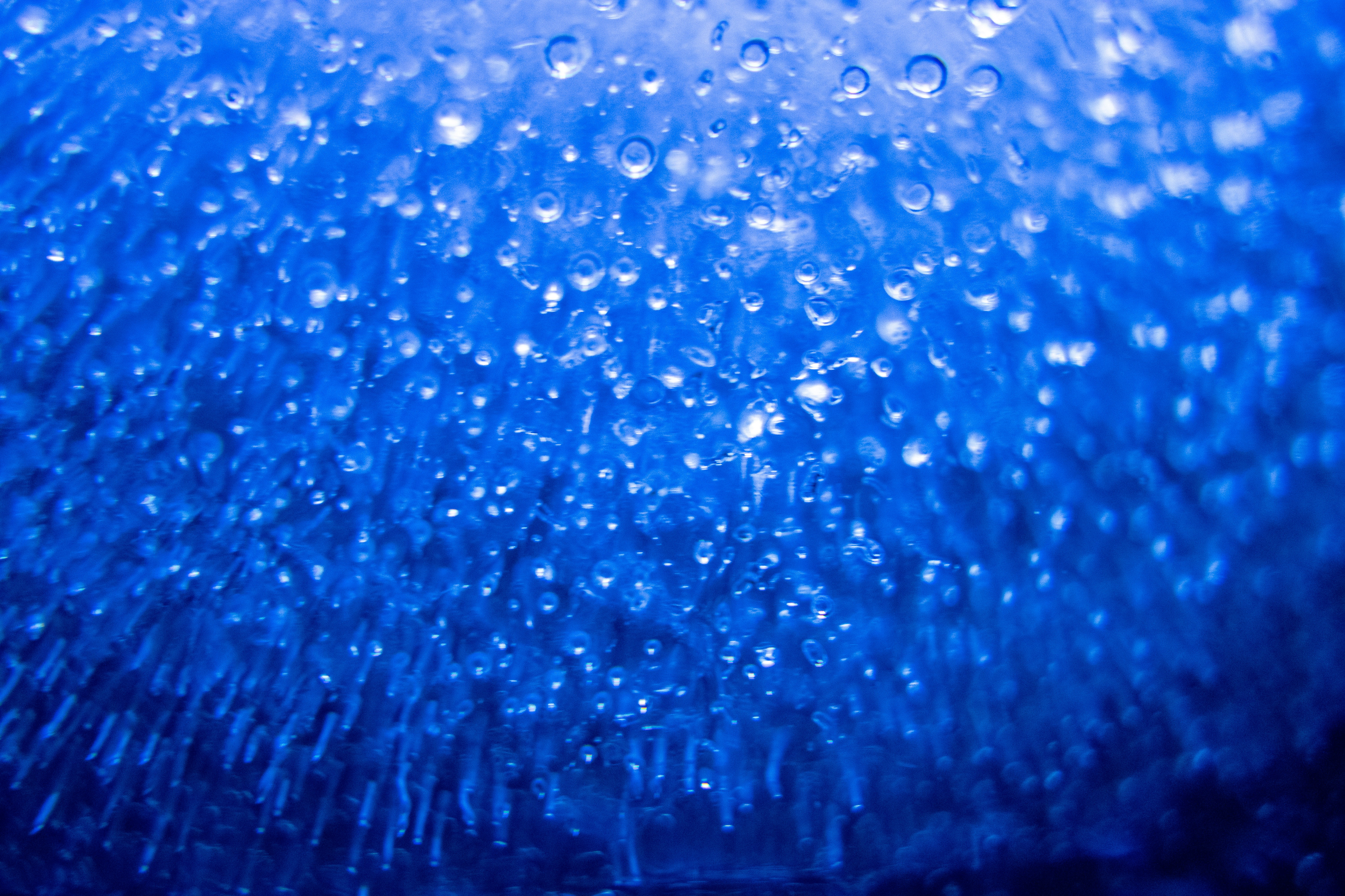 Blue Microcosm: A Surge of Drops in Macro Motion