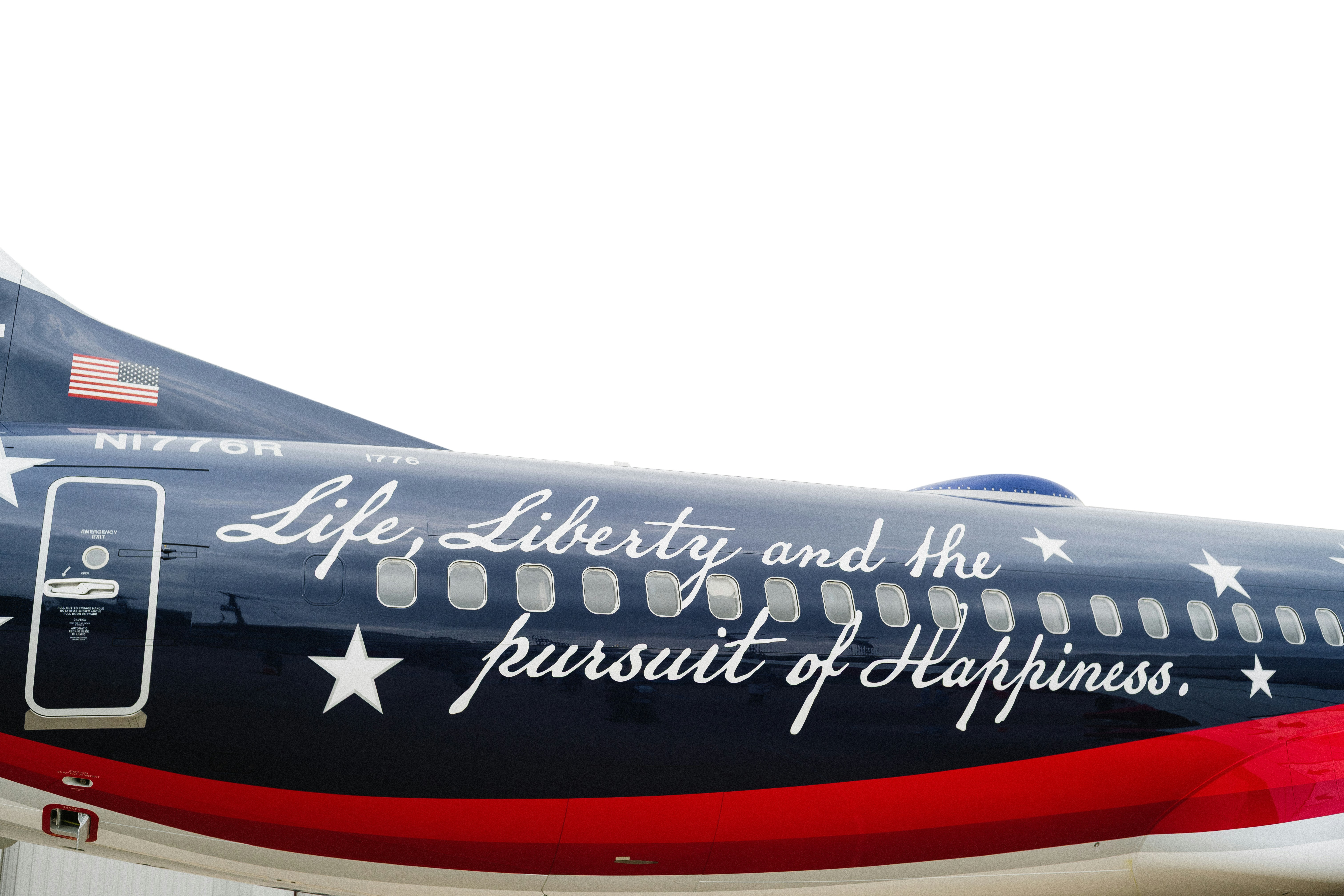 Edge of Freedom: The Navy Blue Fuselage with Slogan lettered along the windows