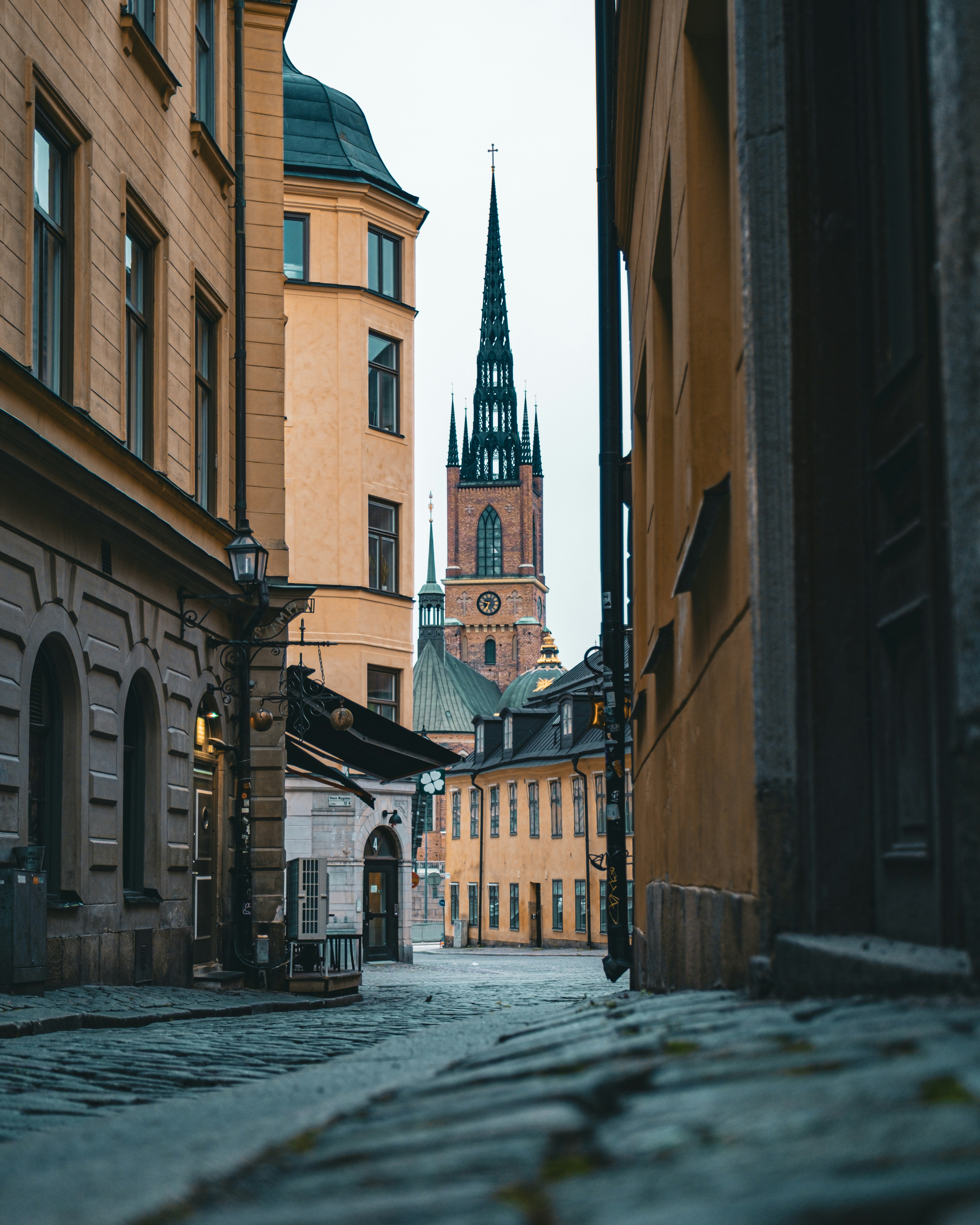 Cathedral Spire Rising Above a Narrow European Lane