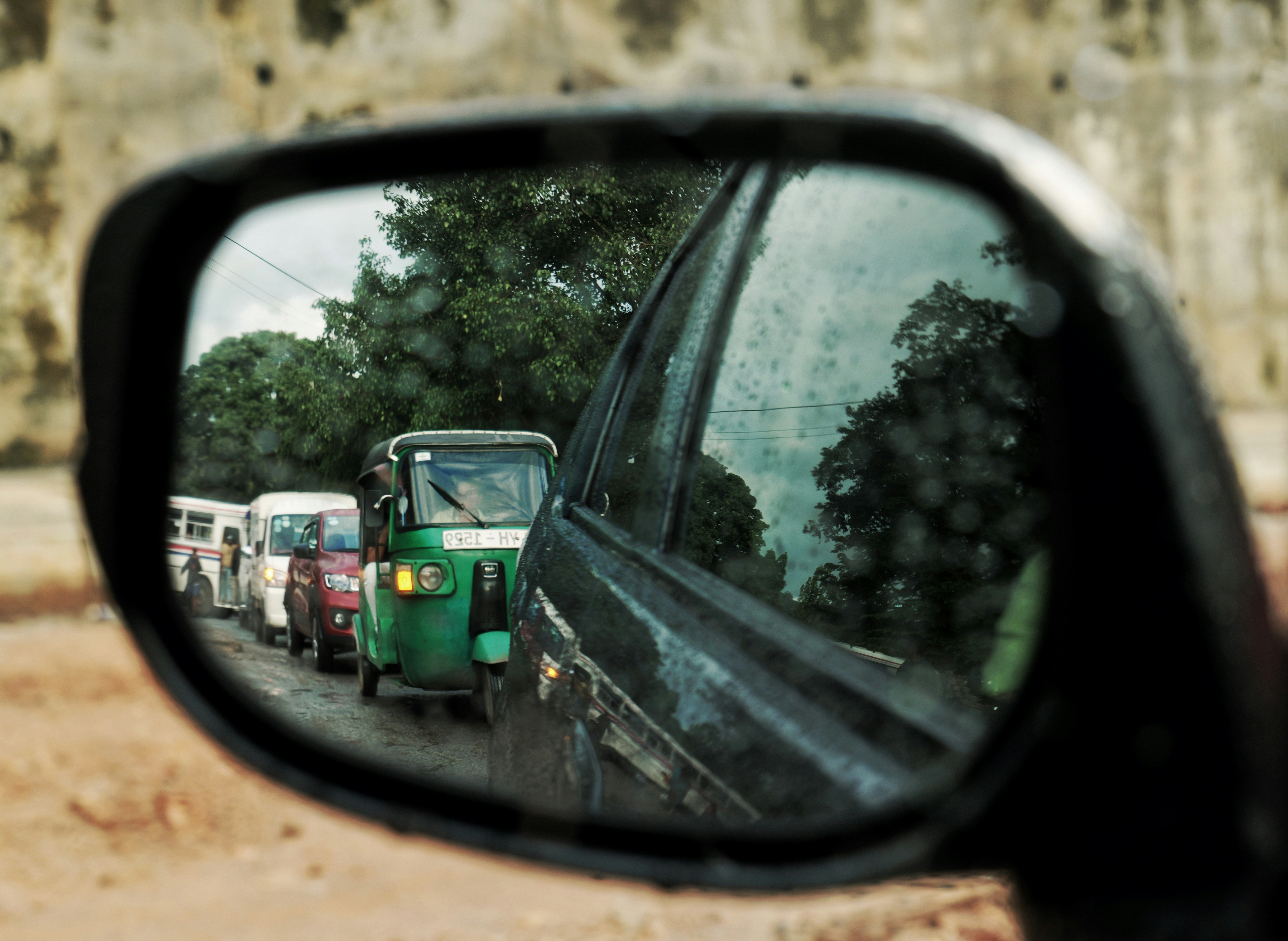 Reflective Side View: Taxis in a Rear-View Gallery