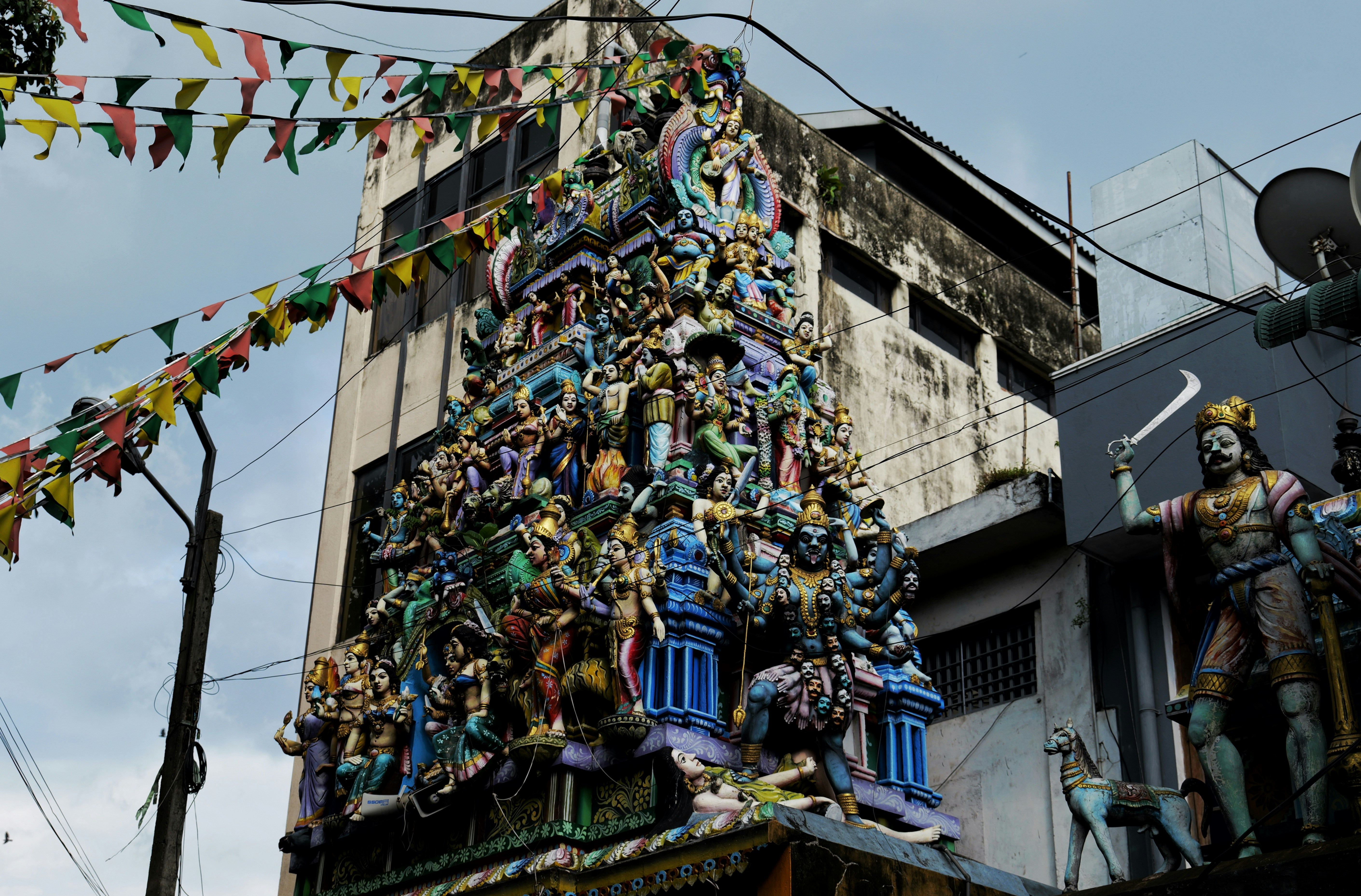 Colorful Hindu Temple Carving Reaching Toward the Skies