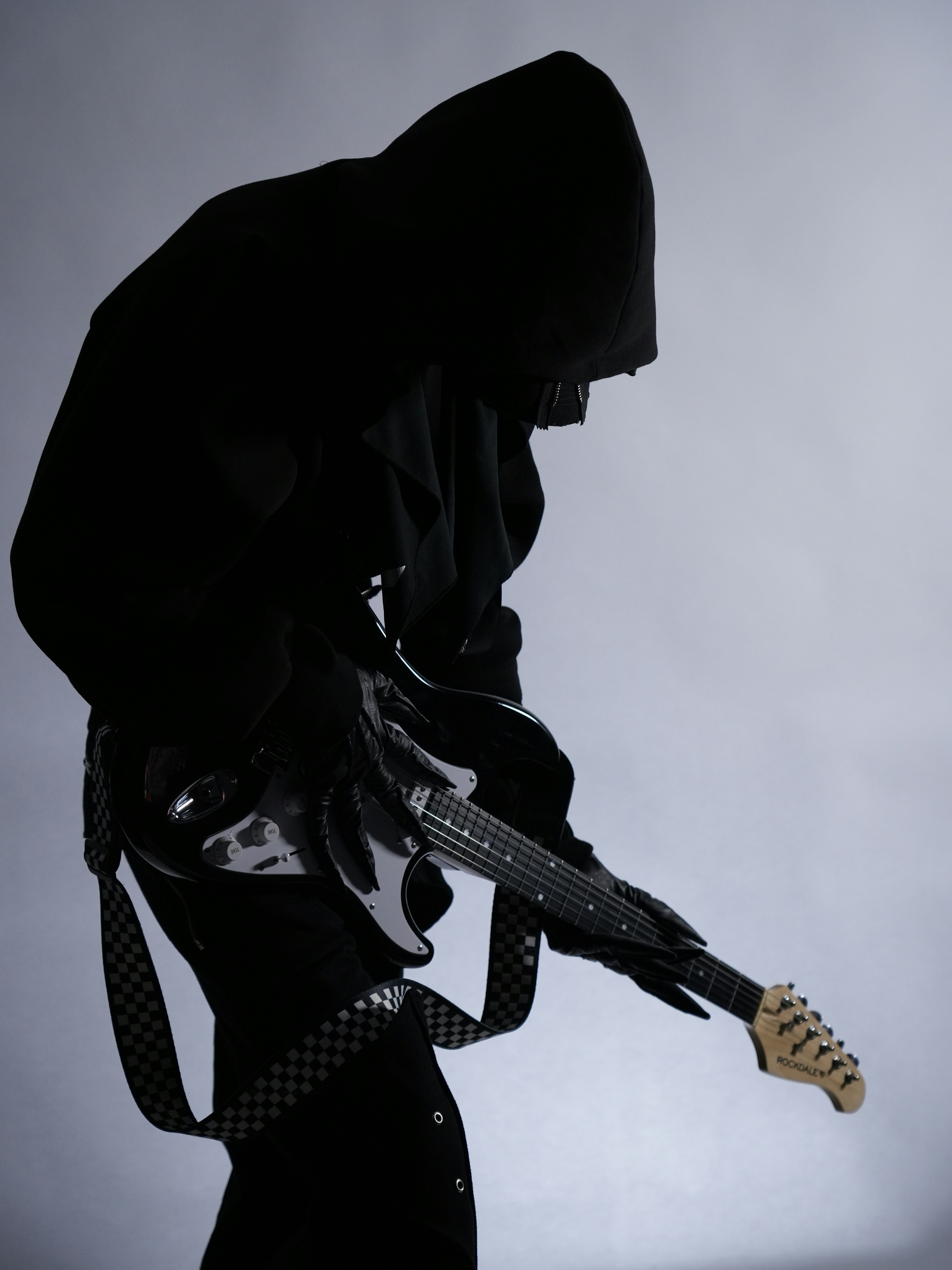Shadowed Virtuoso: A Lone Guitarist in Monochrome Twilight
