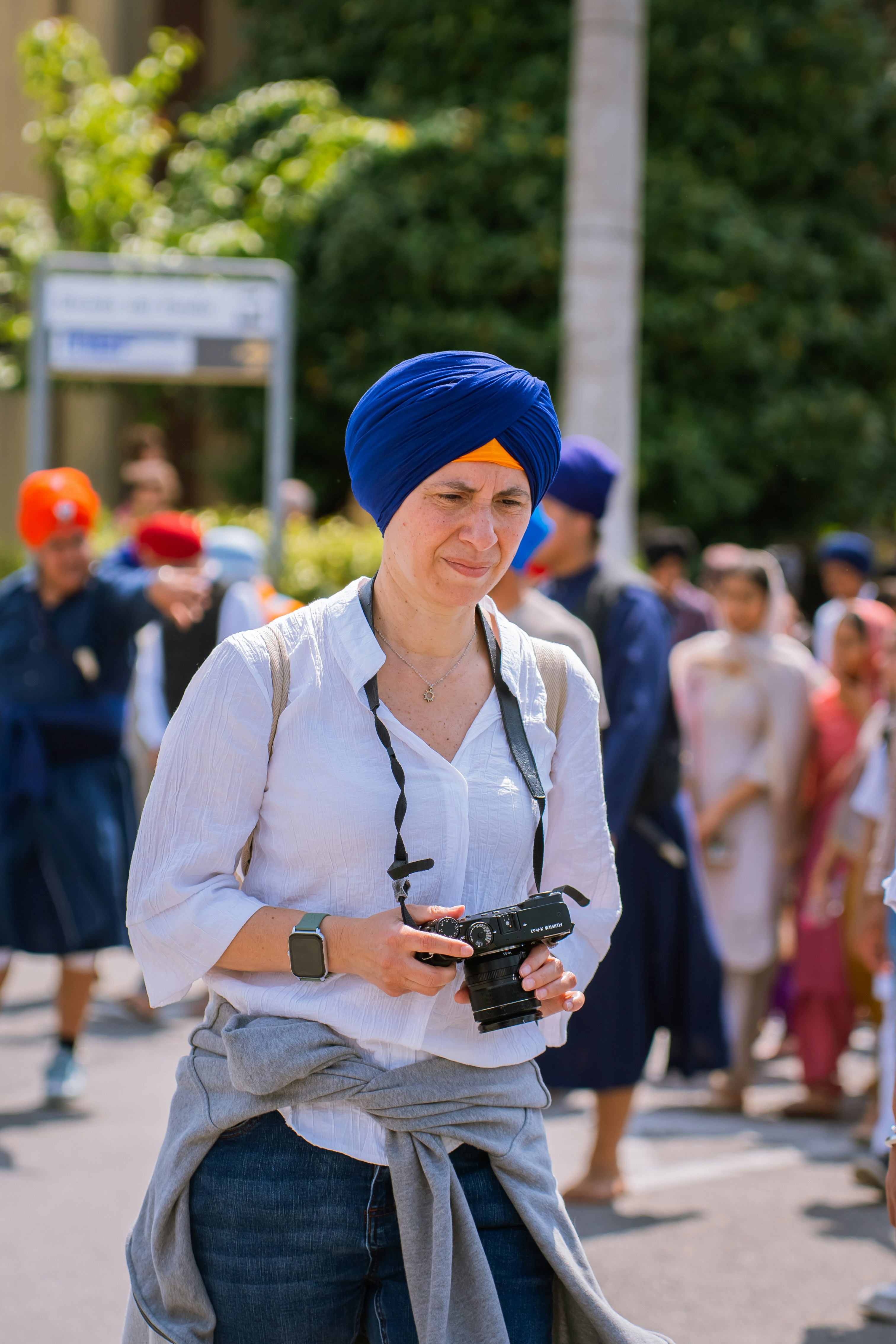 Blue Turban, Focused Frame: A Street Photographer in the Crowd
