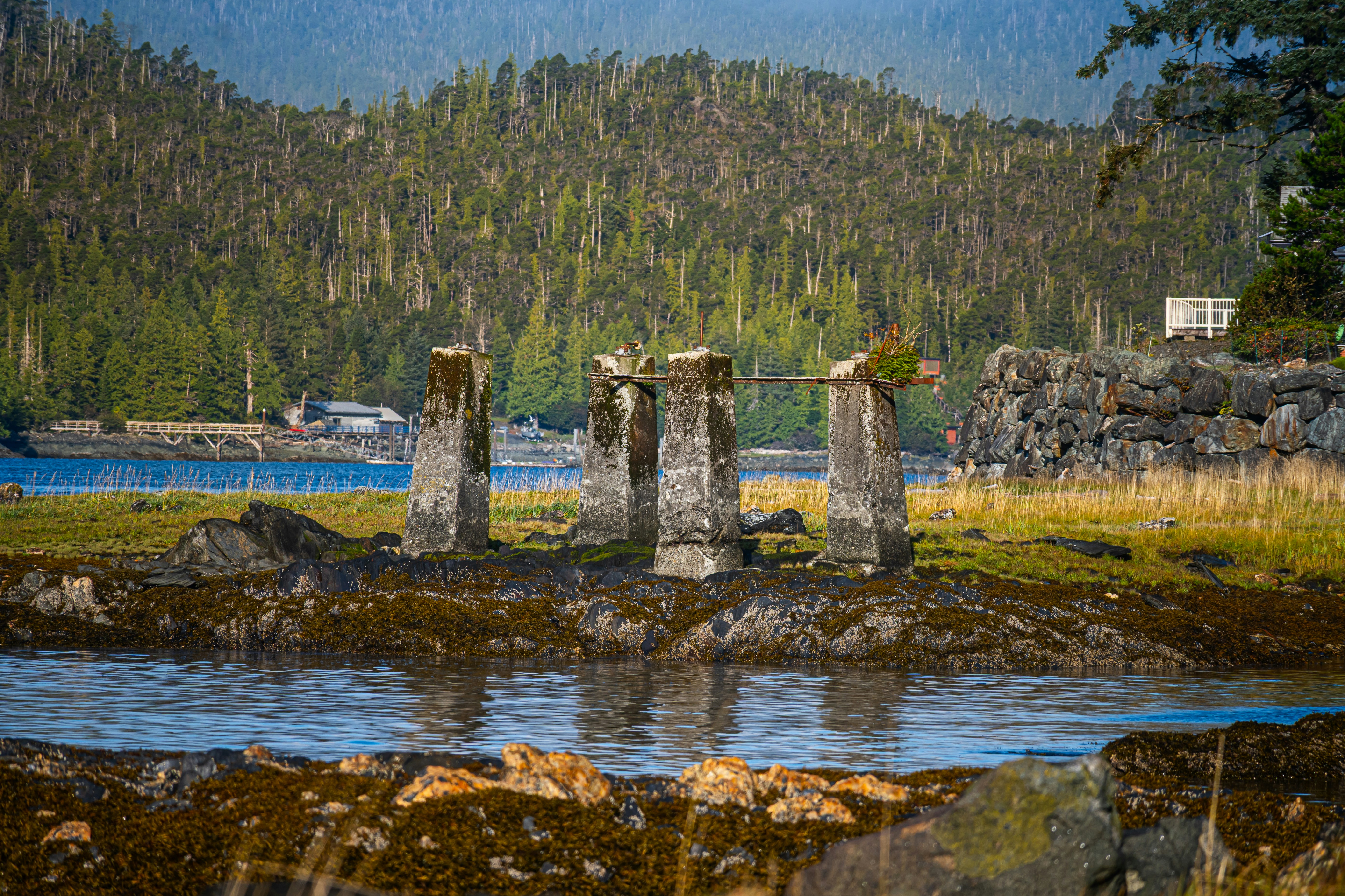 Stone Pillars on a Narrow Island: A Quiet Waterfront Dawn