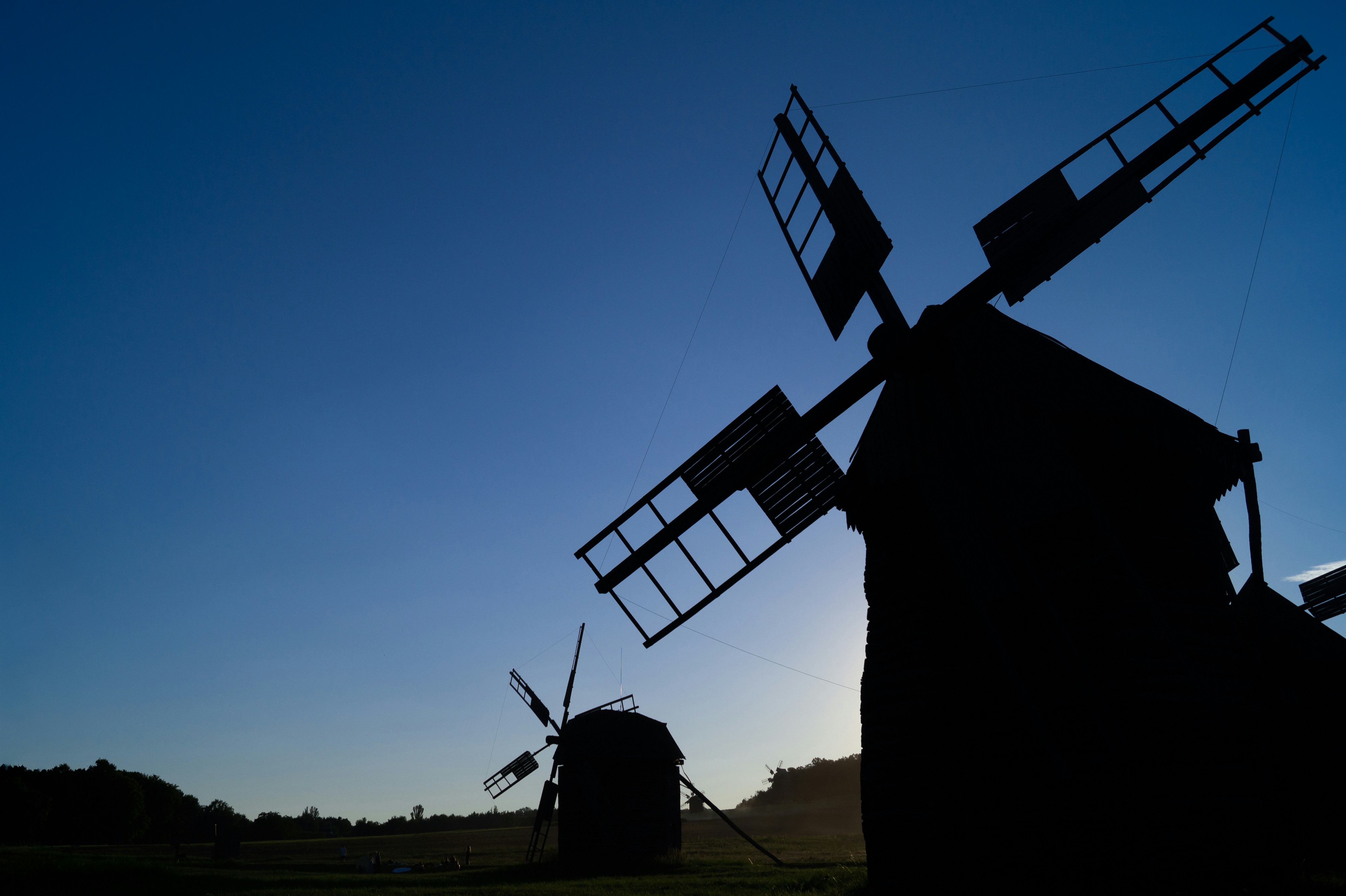 Silhouetted Windmills at Dusk: Quiet Horizon