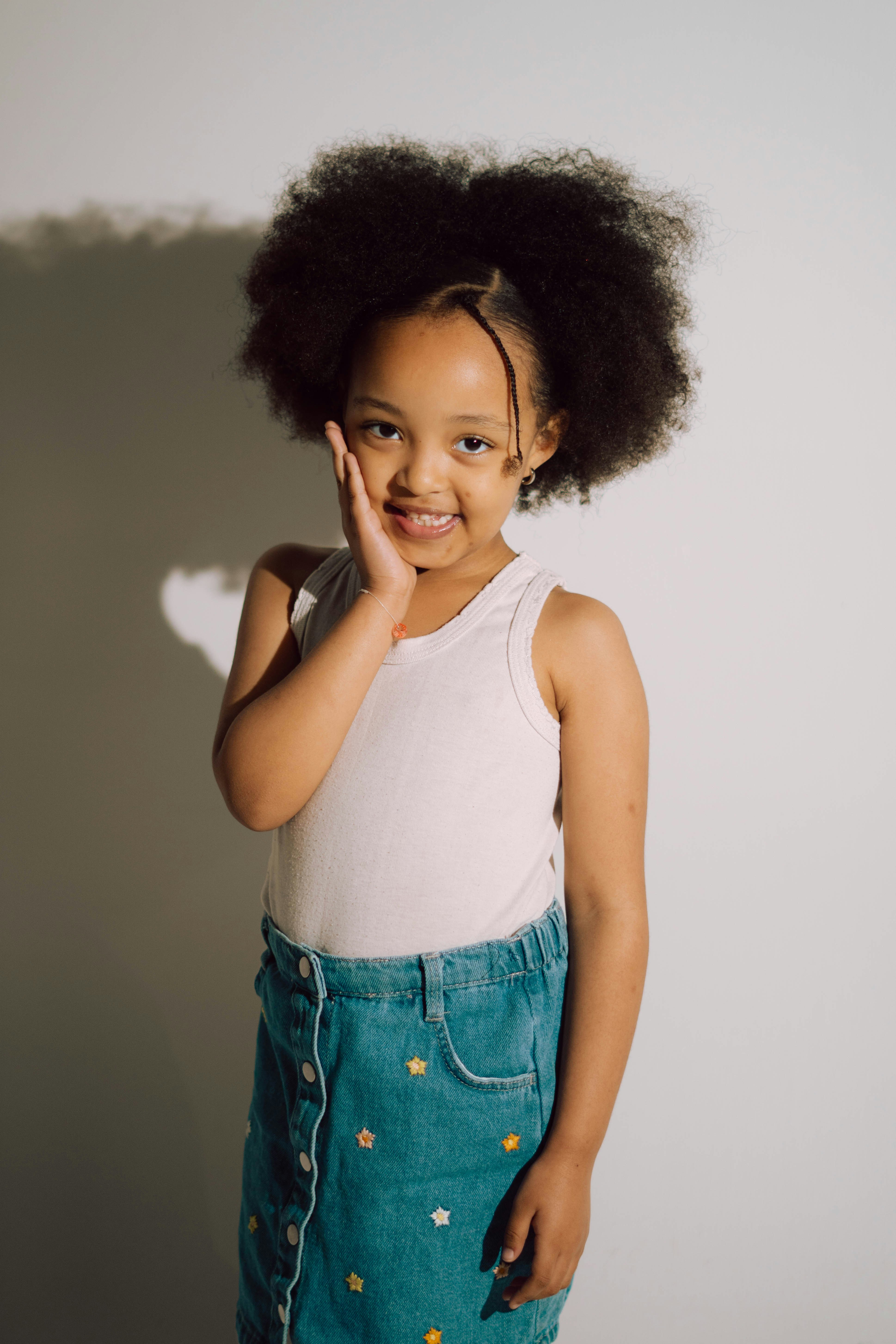 Joyful Portrait of a Young Girl in Playful Light