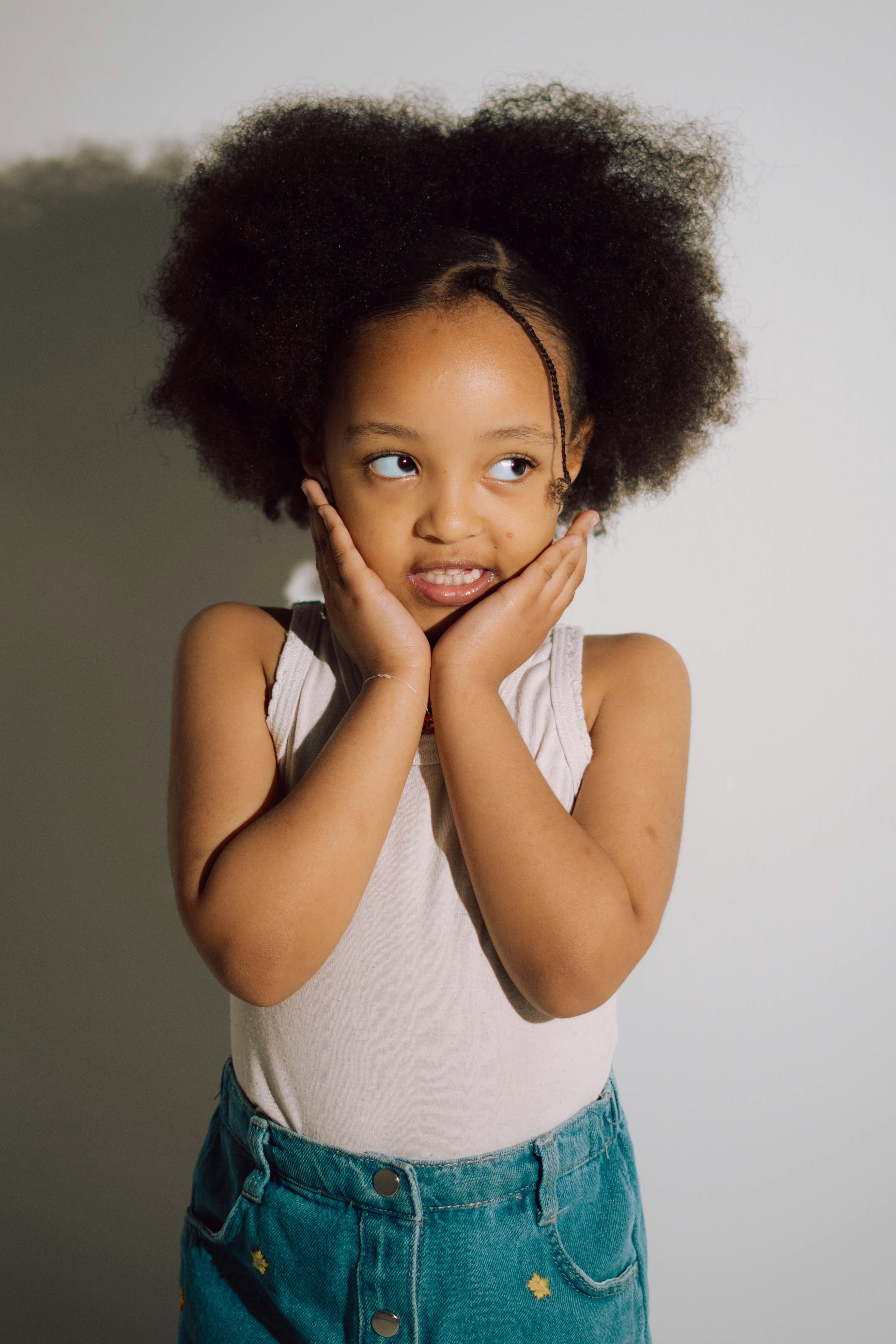 Curious Expression: A Portrait of Playful Light on a Young Girl