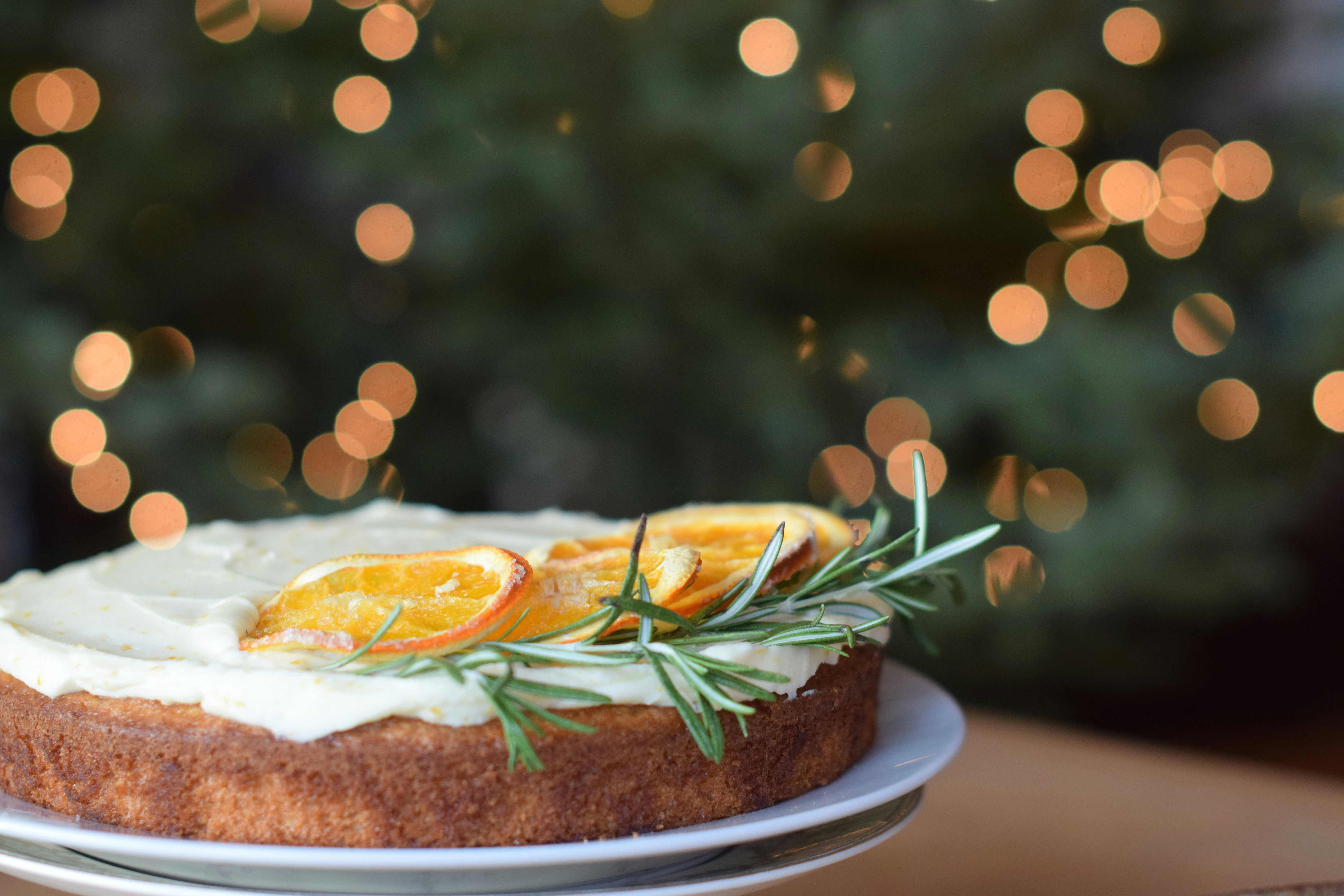 Herald of Fall: A citrus-topped cake on a sunlit plate