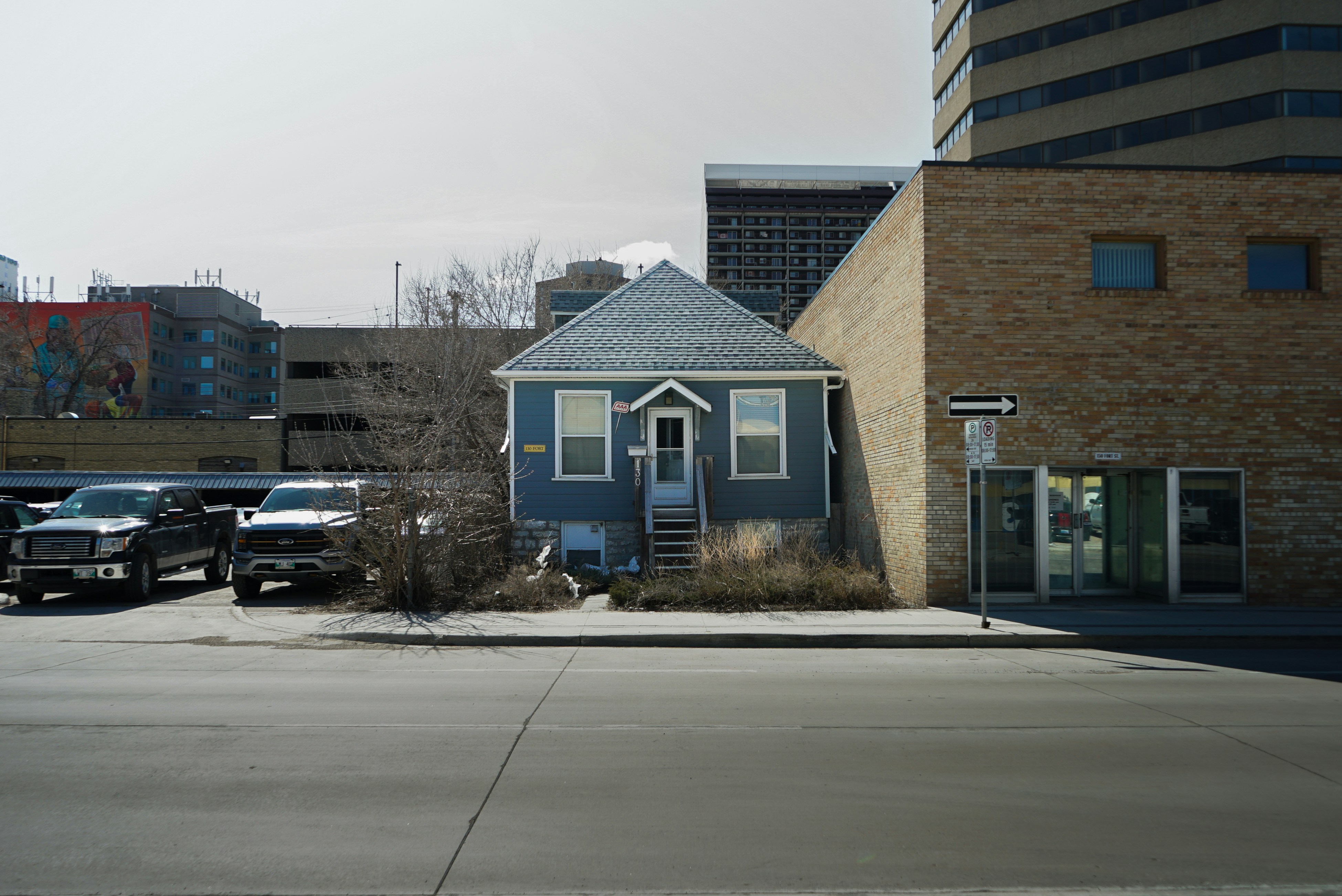 Blue Cottage at the Edge of the City
