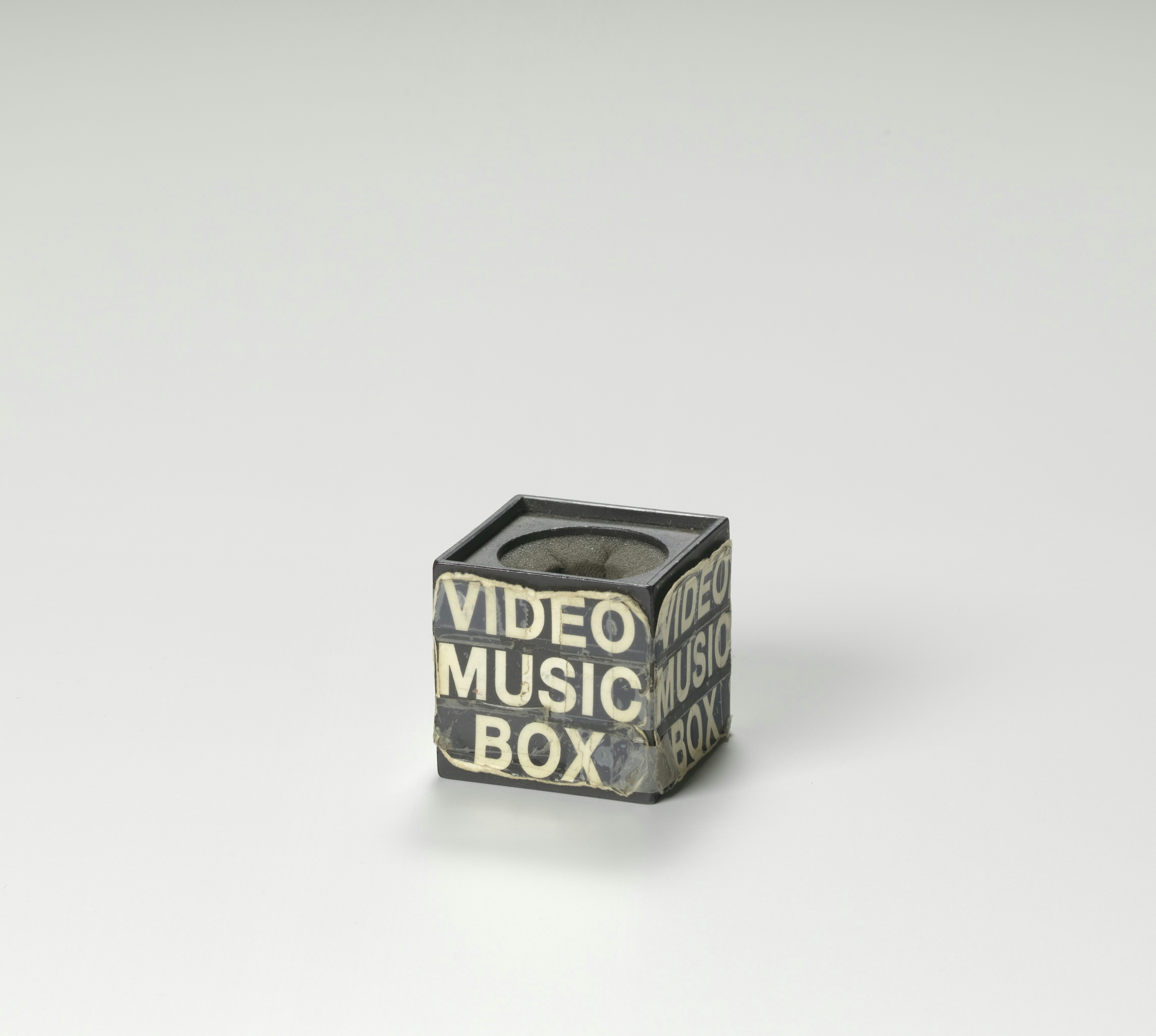 Miniature Cube of Sound: A Boxed Vinyl Art Pose on White