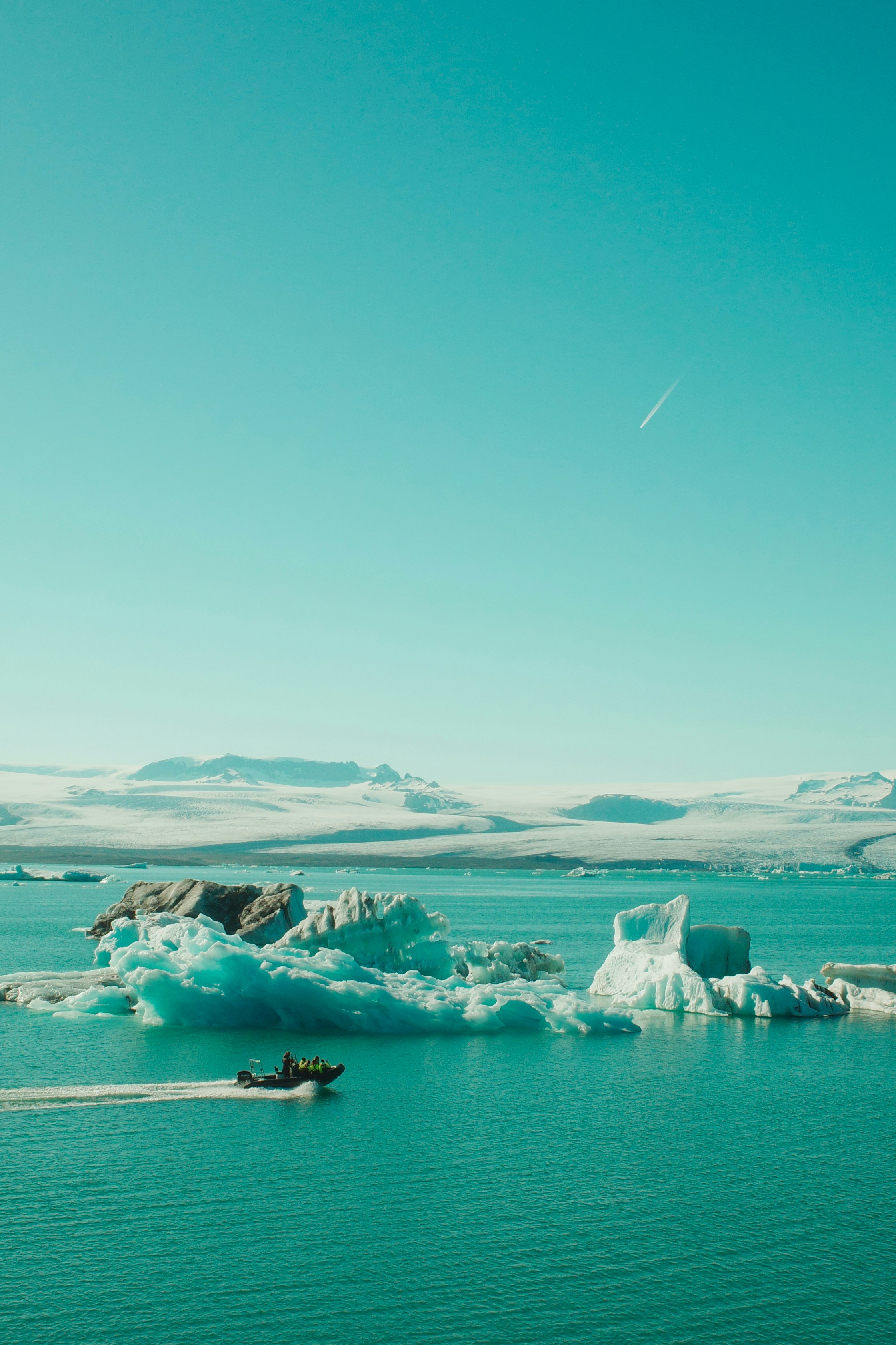 Icefield Passage: A Quiet Boat Advances Across Turquoise Fjord