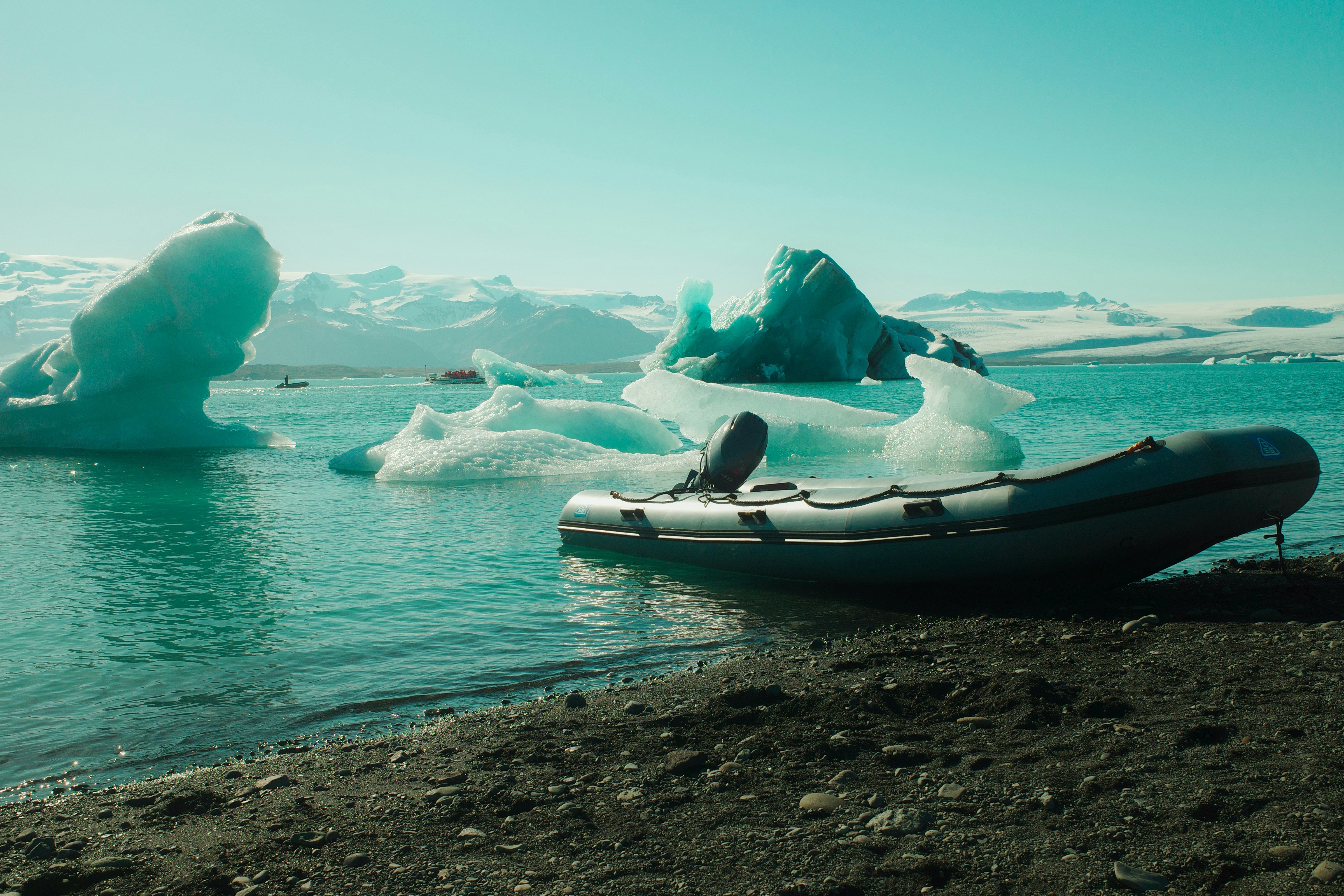 Icebound Landing: A Ribbed Rubber Boat at the Edge of Glacial Waters
