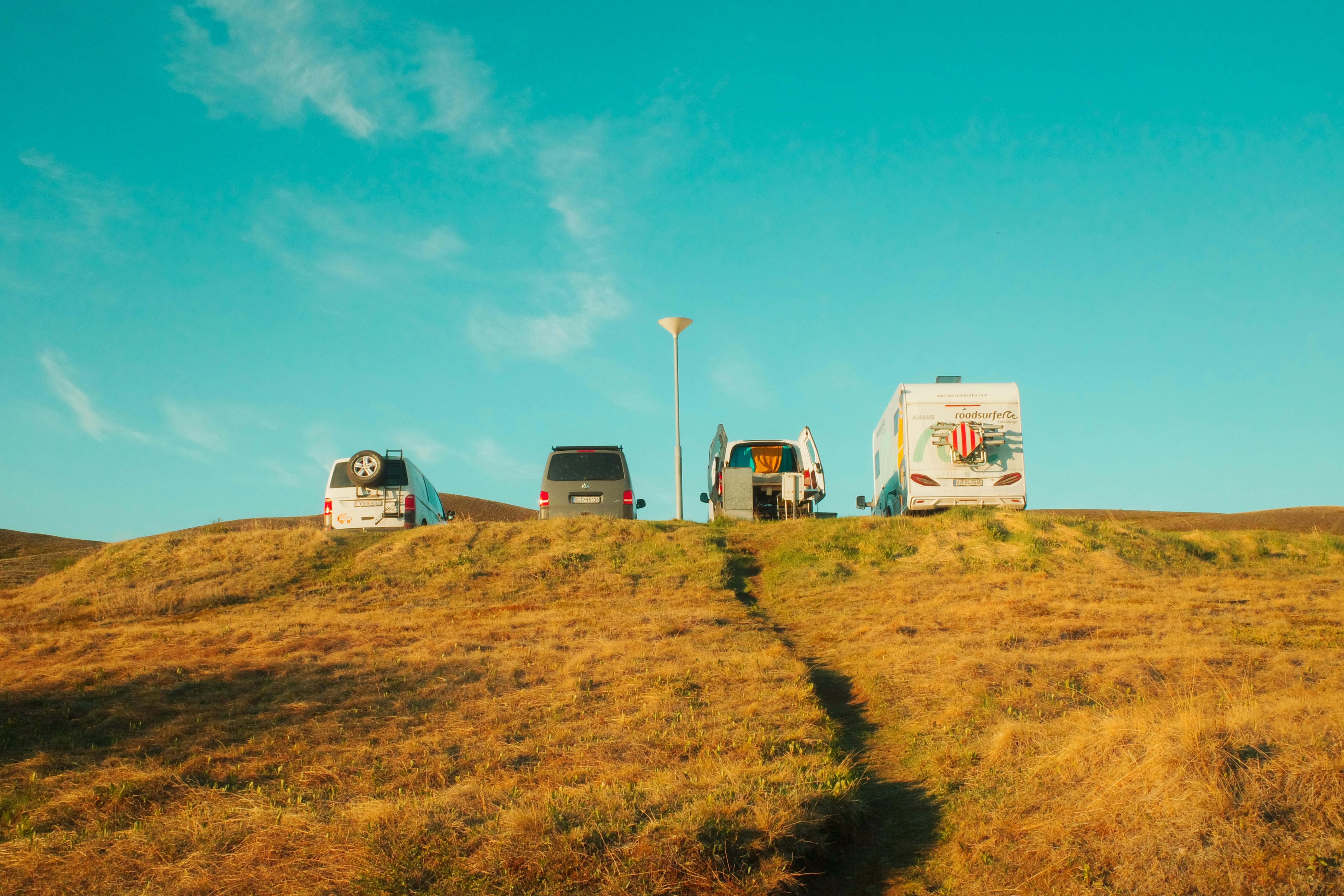 Vehicles at the Crest: A Quiet Hilltop Standstill