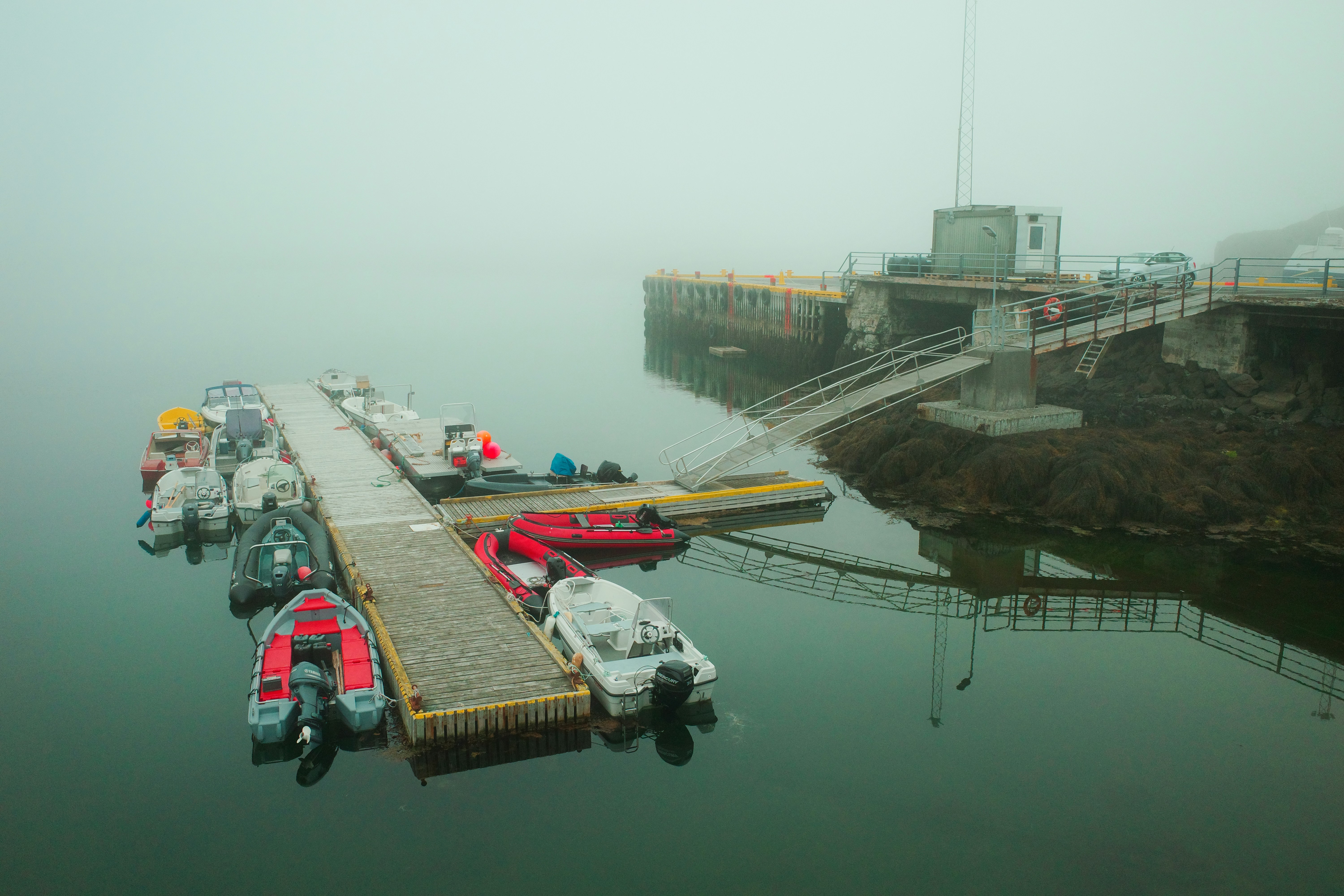 Fog-Soft Dock: Boats Rest at a Quiet Marina