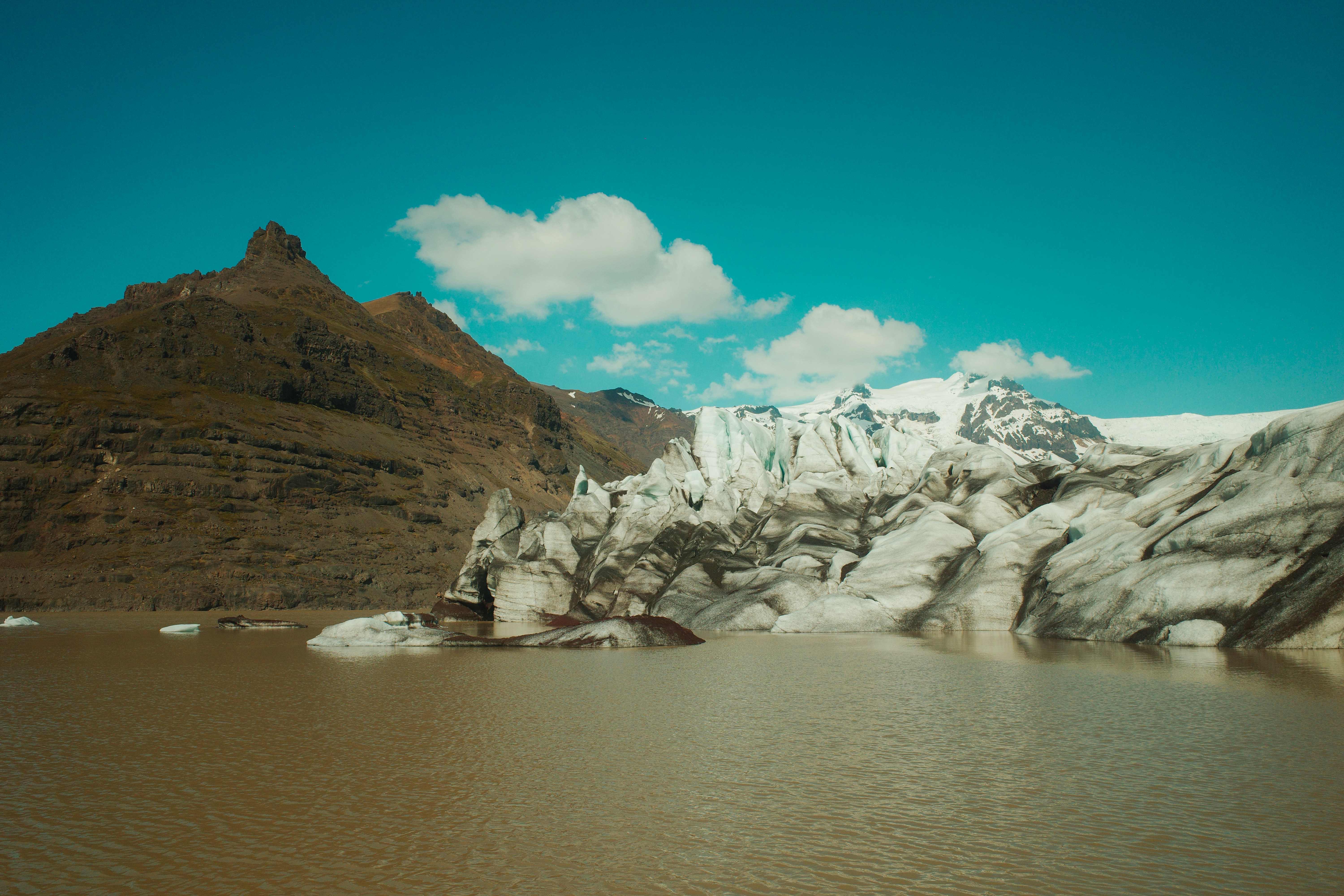 Glacial Edge and Desert Shore under a Cerulean Sky