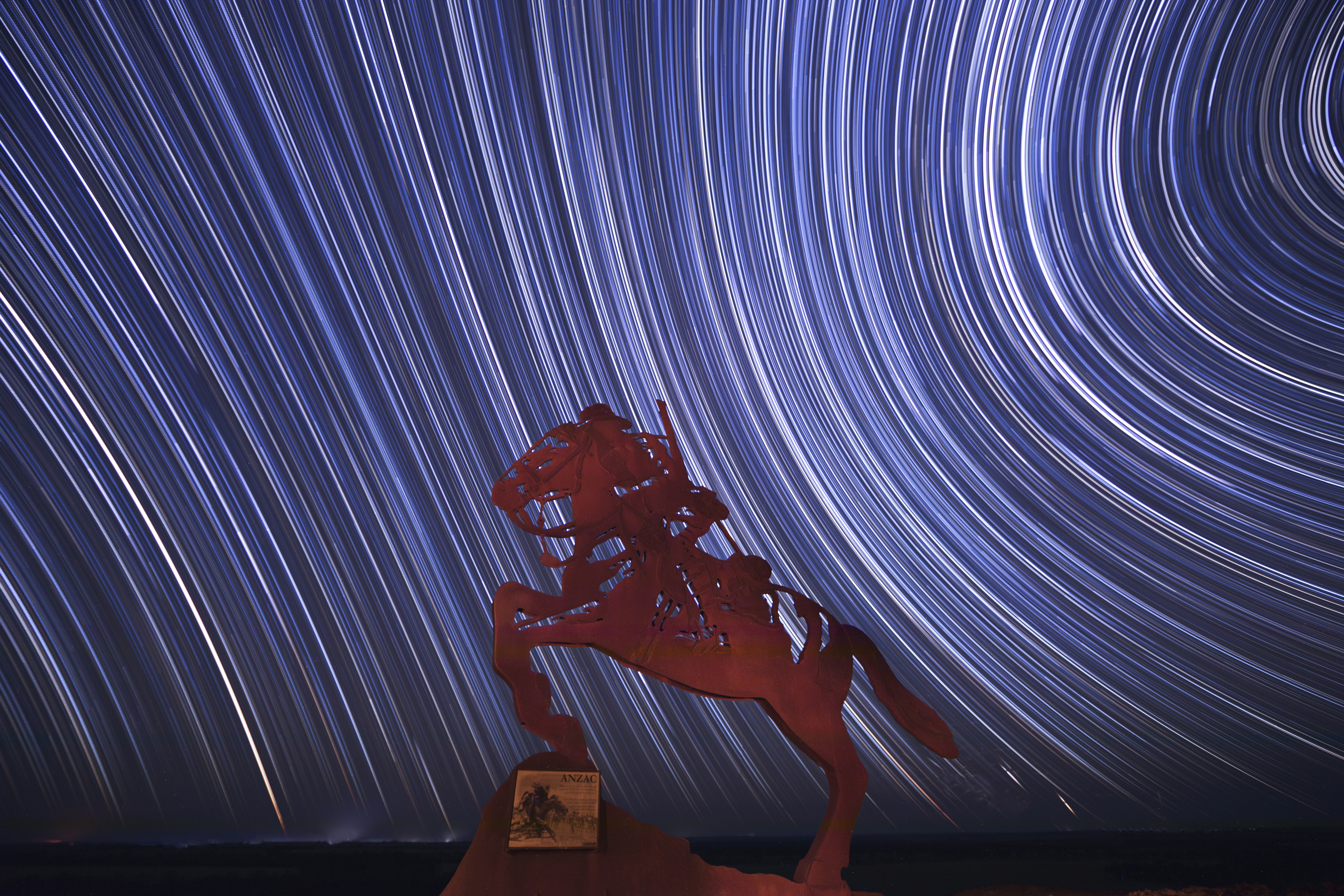Eternal Horse: A Rider Silhouette Against a Sky of Wandering Stars