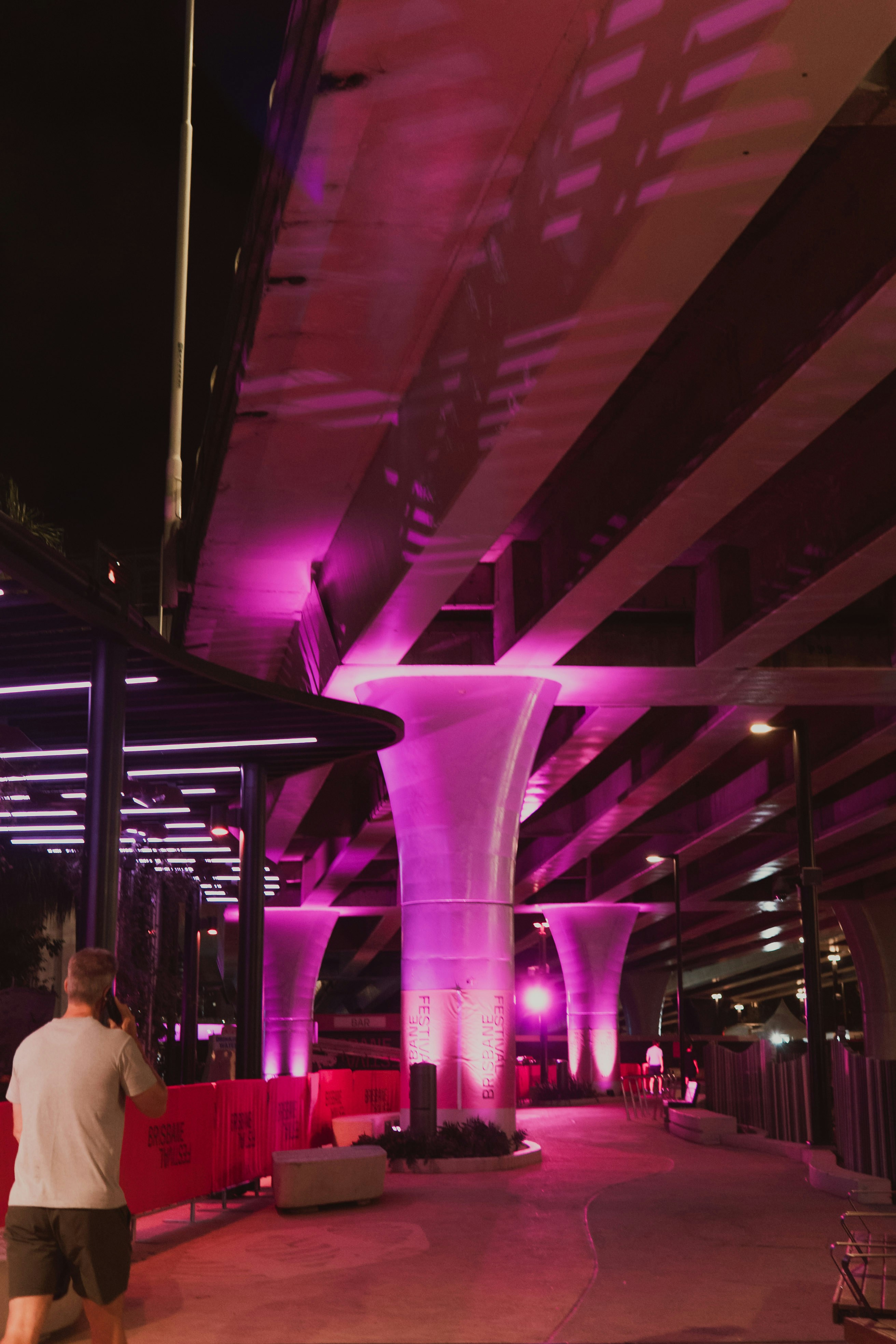 Neon Alley Under the Overpass: Purple Glow and Night Walk