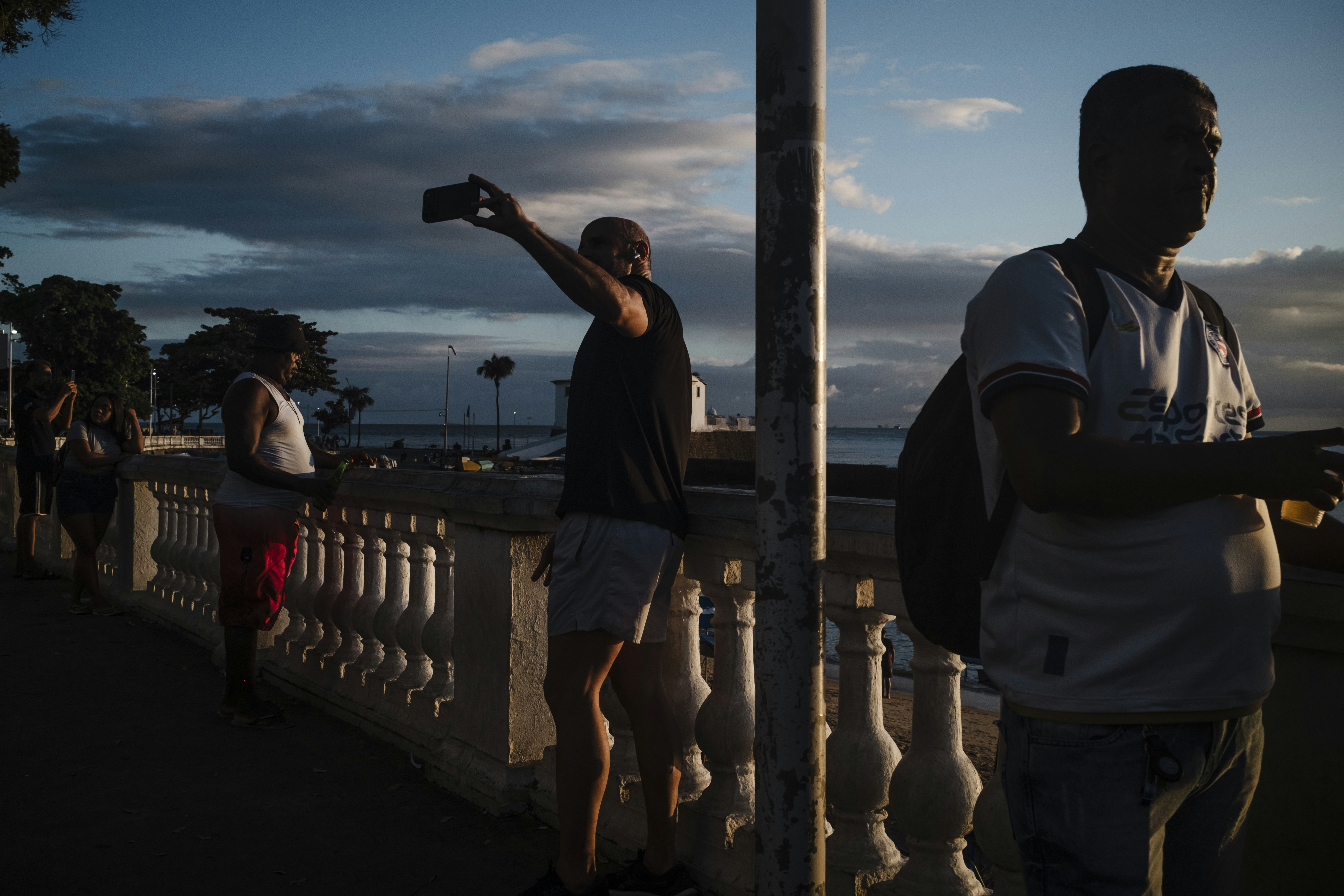 Evening Stroll by the Colonnade: Silhouettes at the Pier