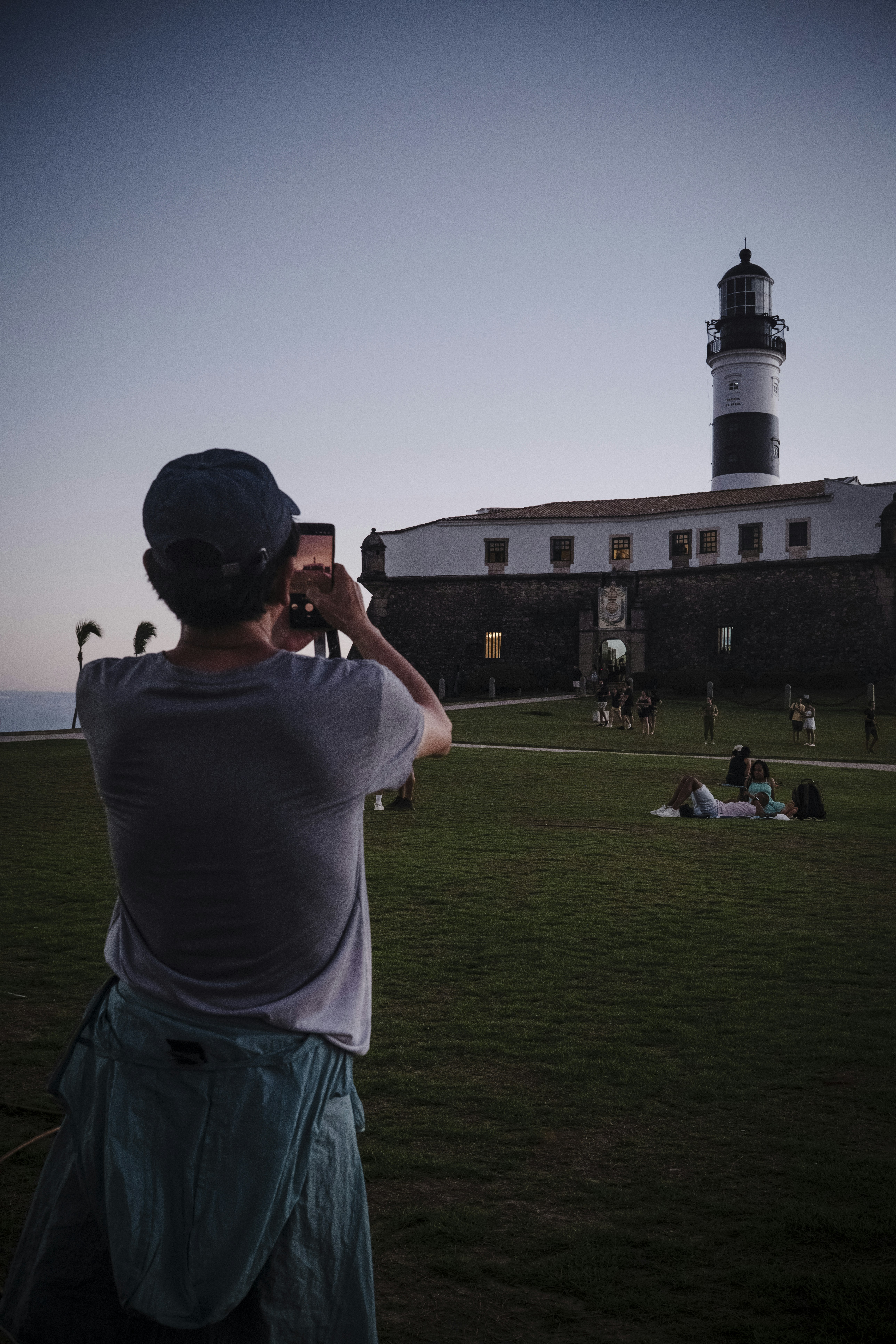 Traveler's Frame: A Lighthouse Portrait at Dusk