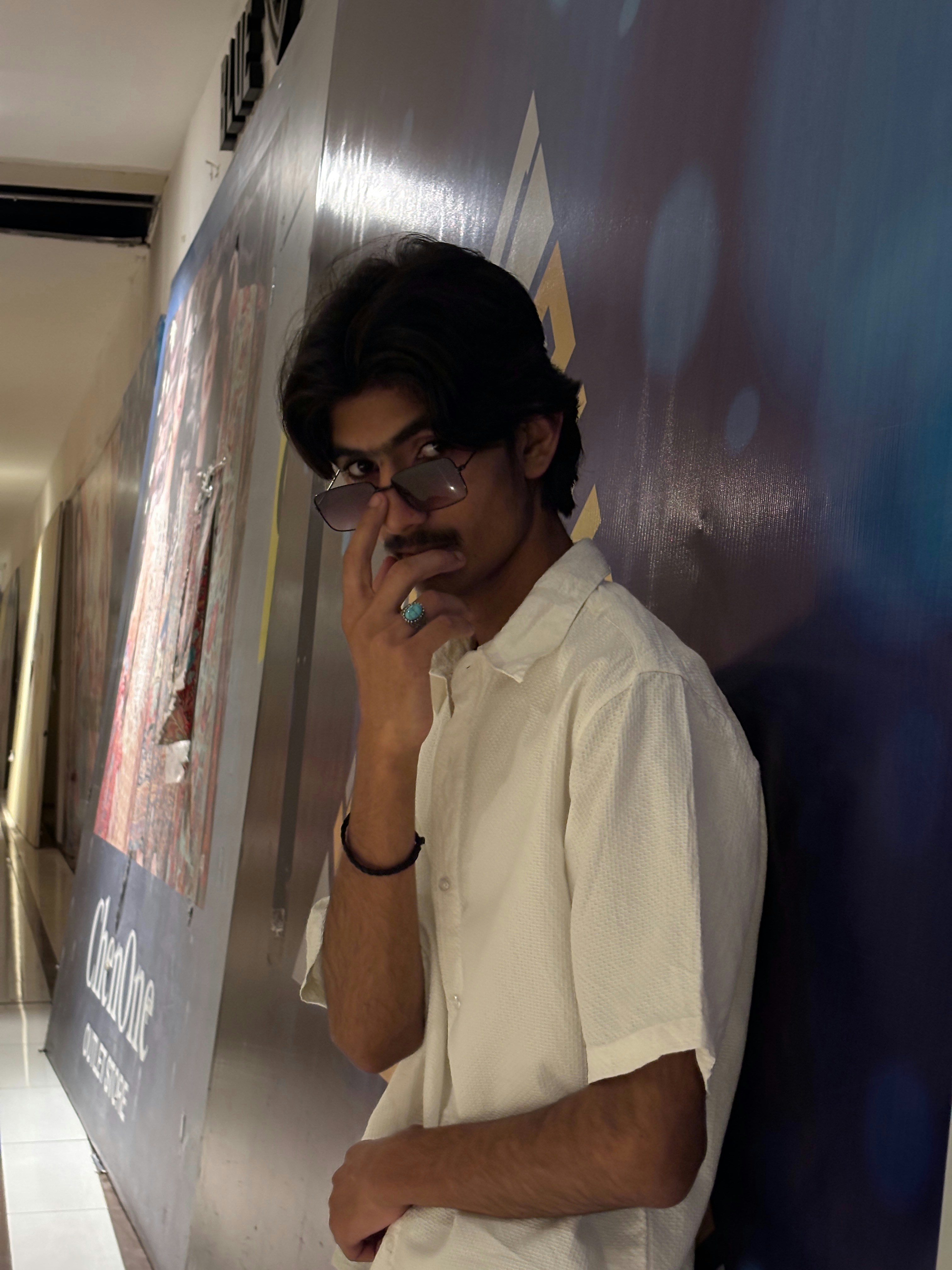 Whispered pose in a glossy corridor
