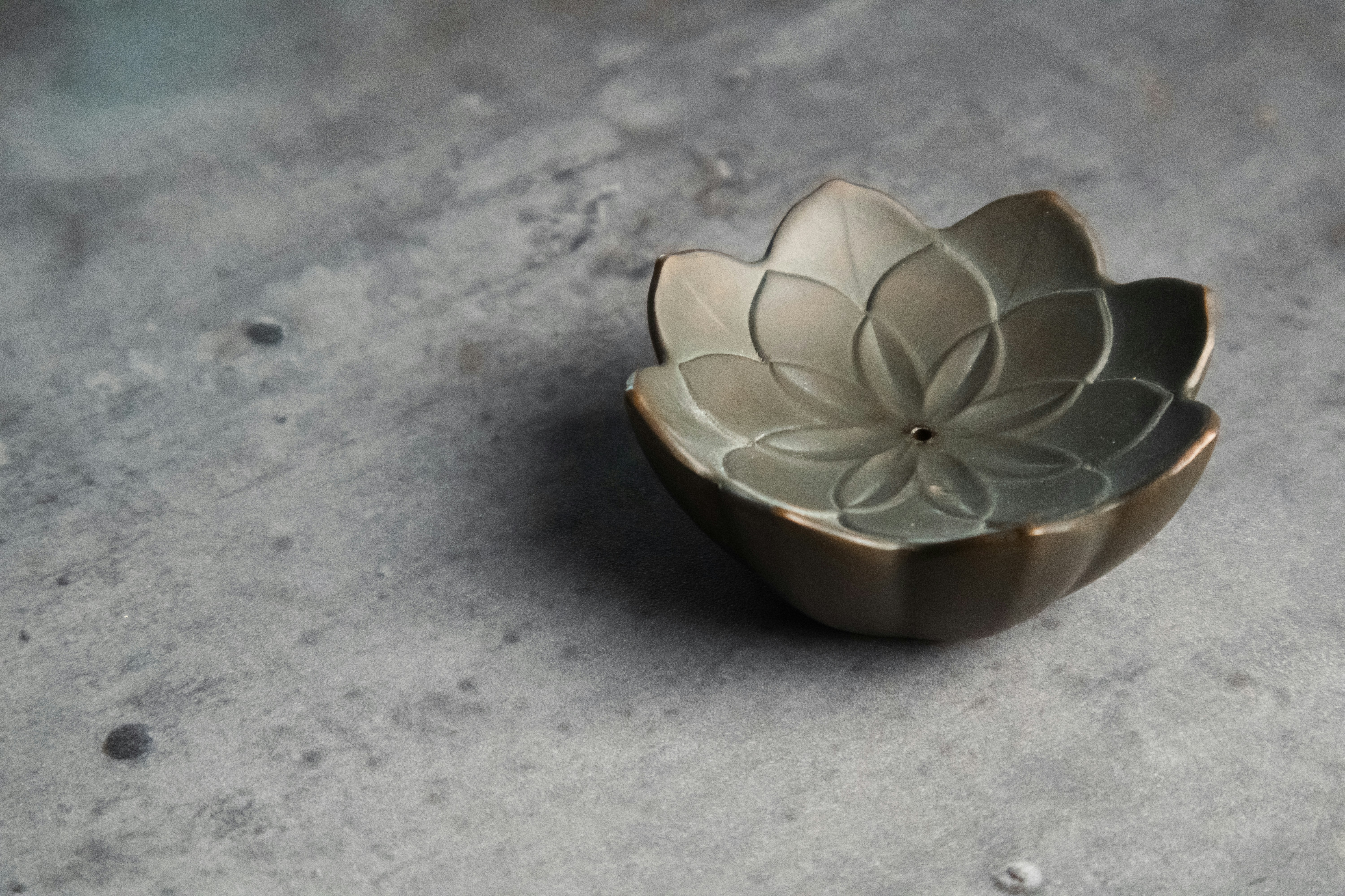 Petal‑Edge Vessel on a Weathered Surface