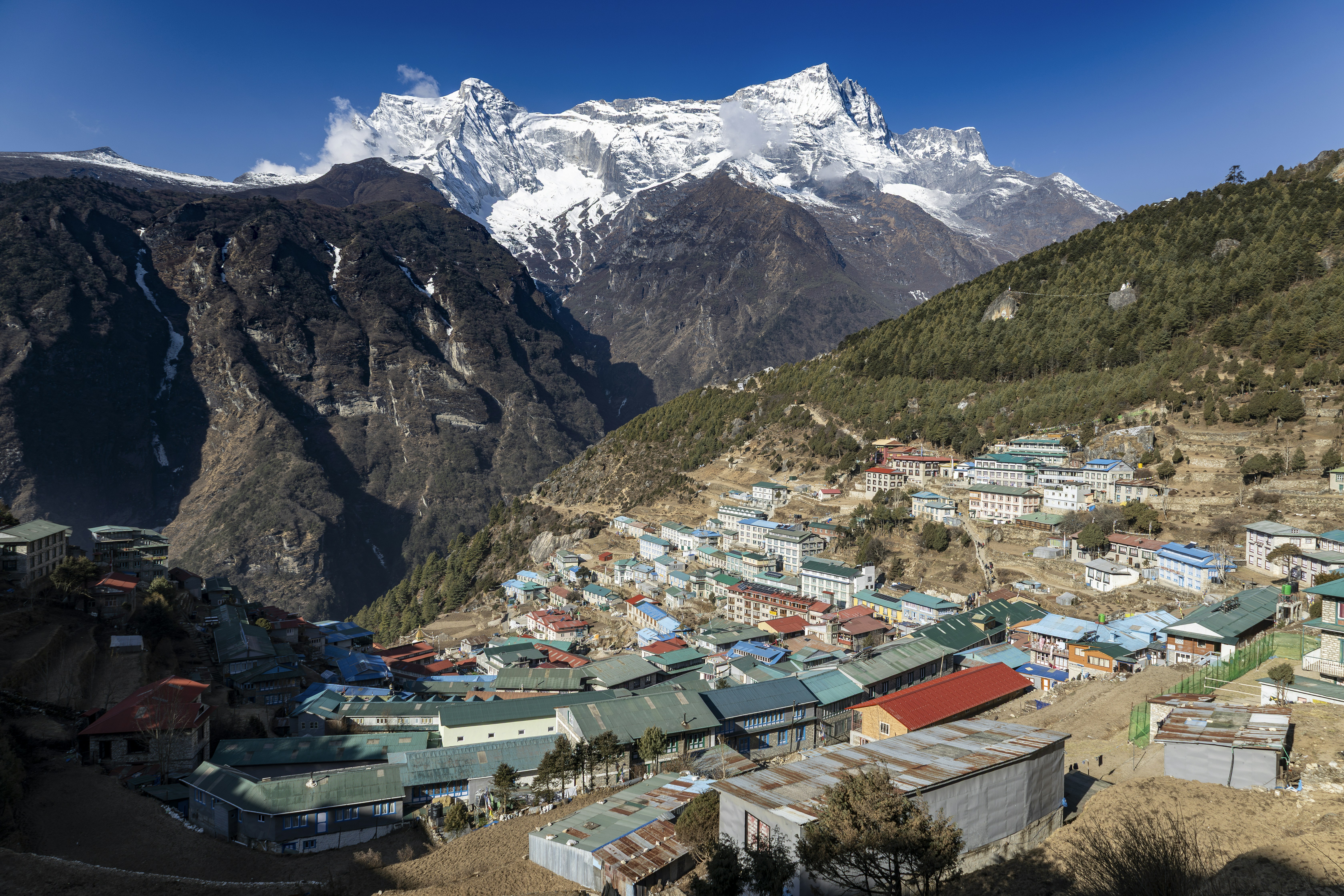 Snowy Peaks Over a Patchwork Town